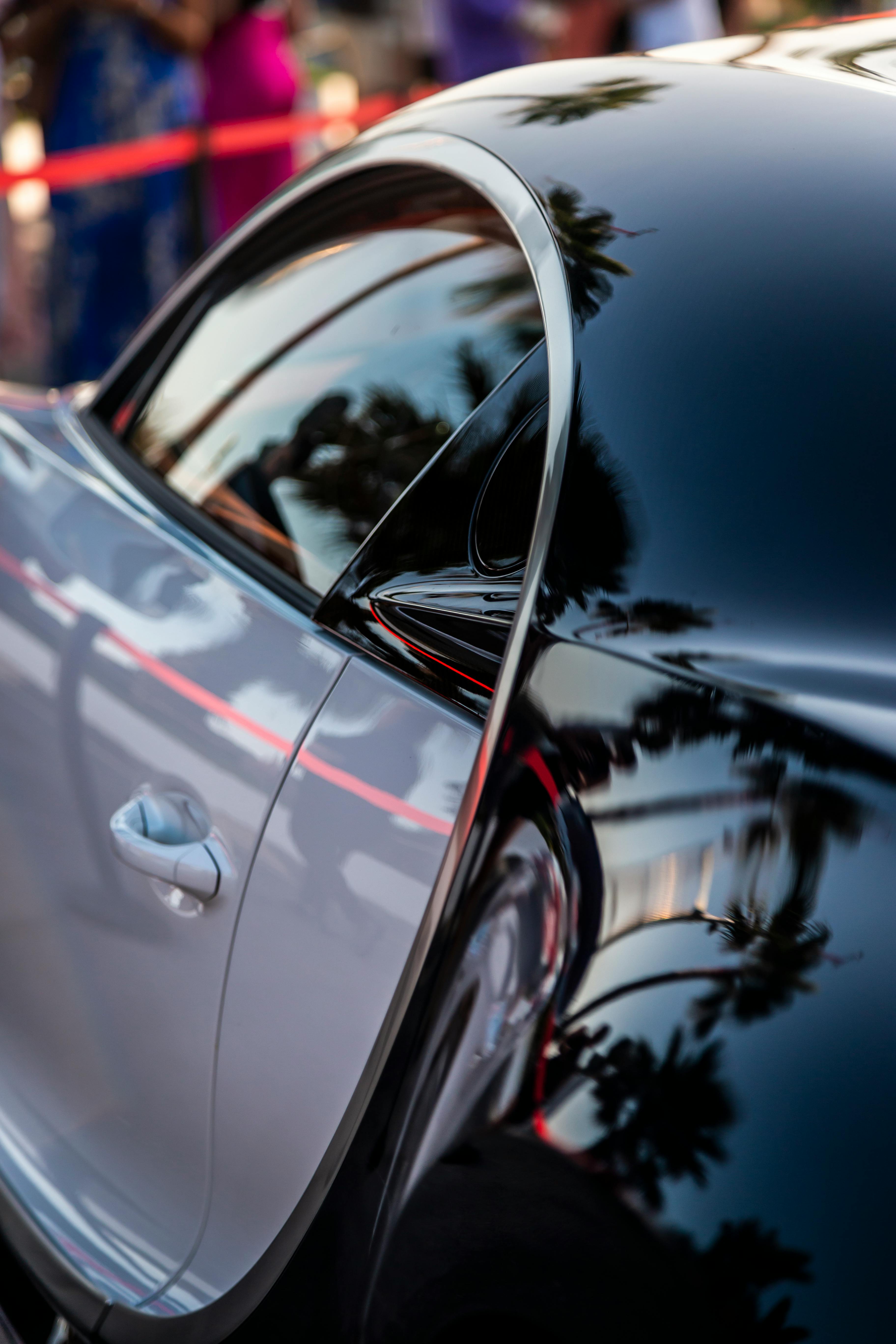 Elegant Supercar Rear with Palm Reflections · Free Stock Photo