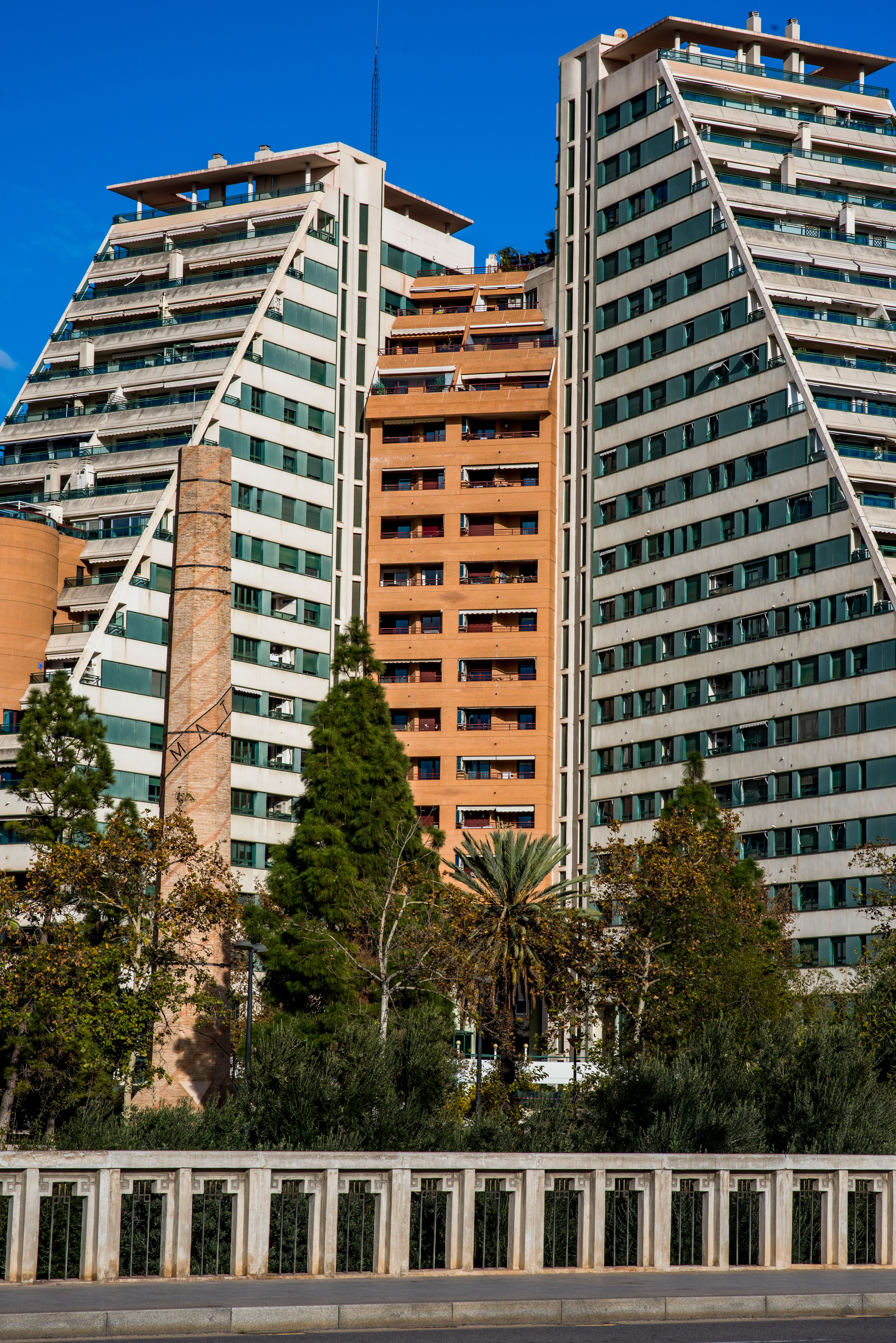 Modern Architectural Towers with Greenery · Free Stock Photo