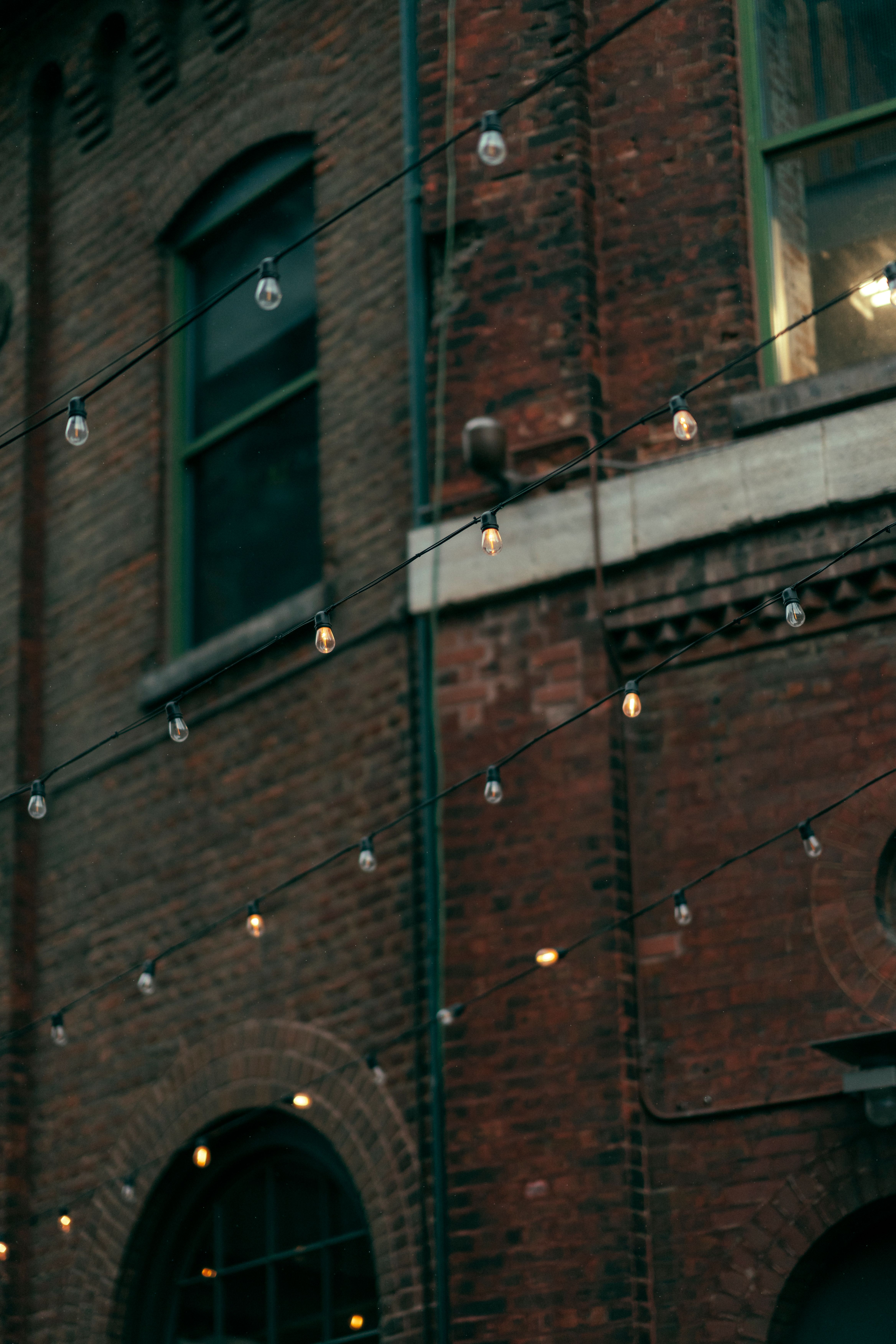 String Lights on Historic Toronto Brick Building · Free Stock Photo