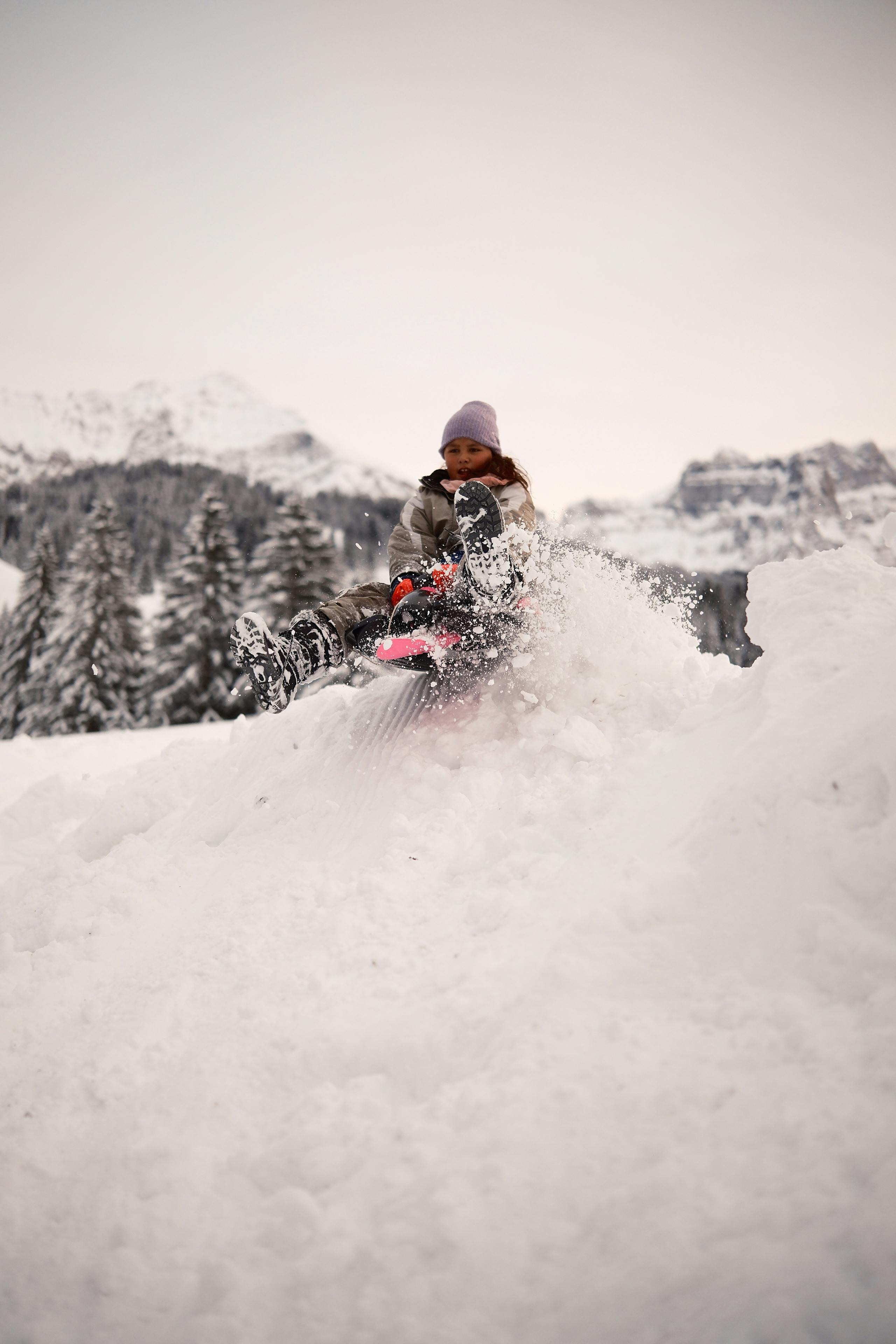 Joyful Snowmobiling Adventure in Winter Mountains · Free Stock Photo