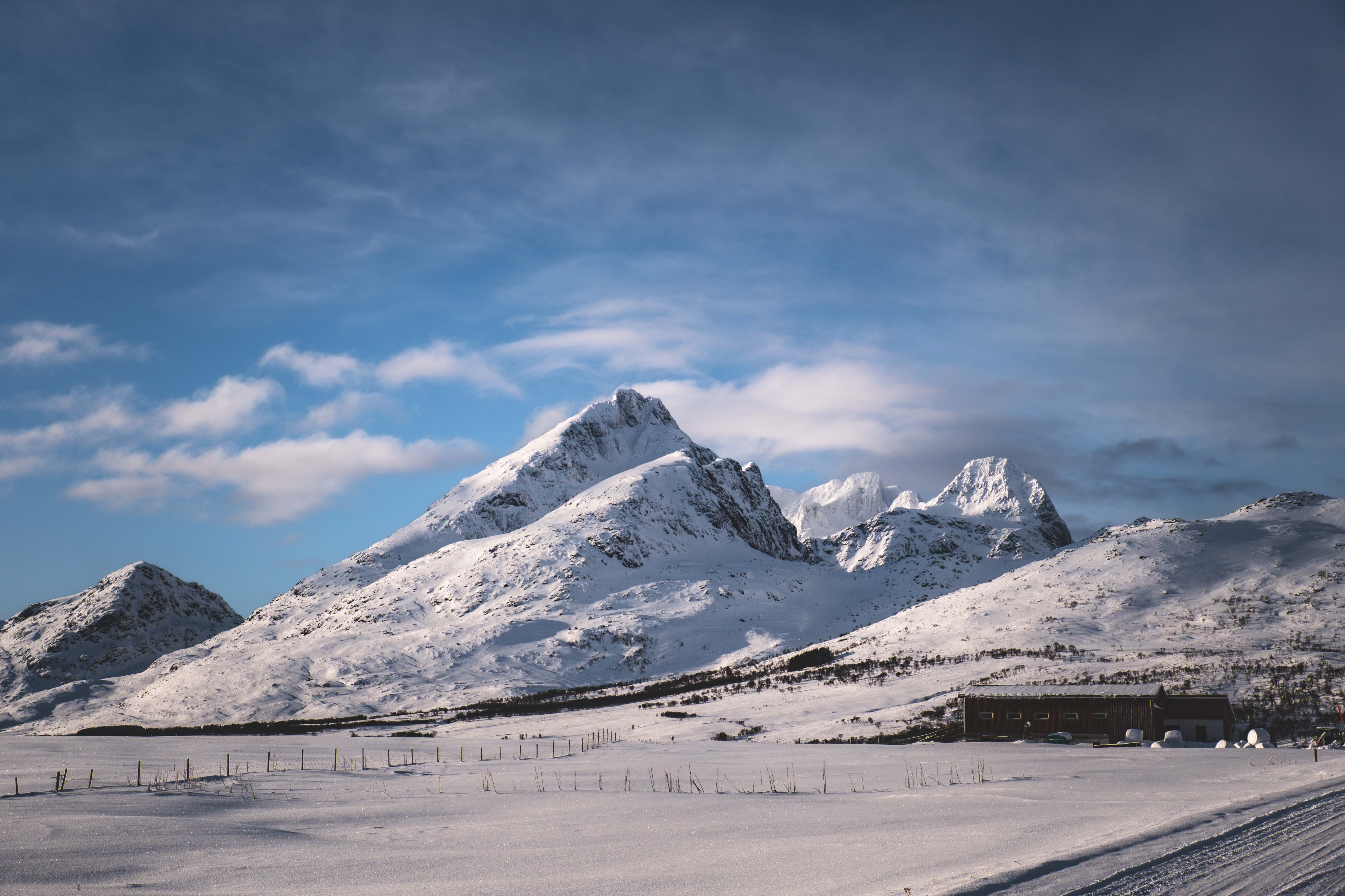 Scenic Snow-Covered Mountains Under Clear Blue Sky · Free Stock Photo