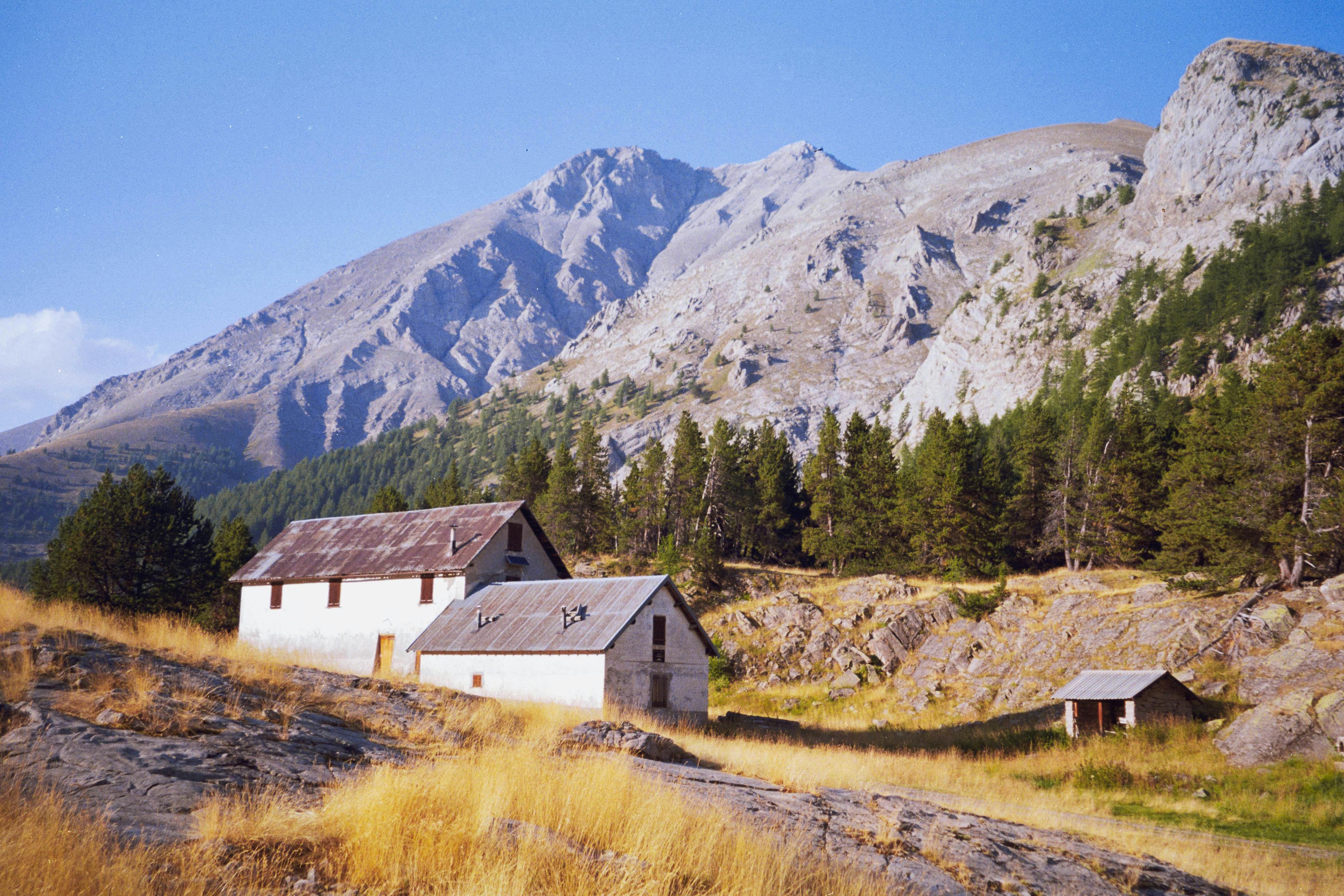 Scenic Alpine Mountain Landscape with Rustic Cabin · Free Stock Photo