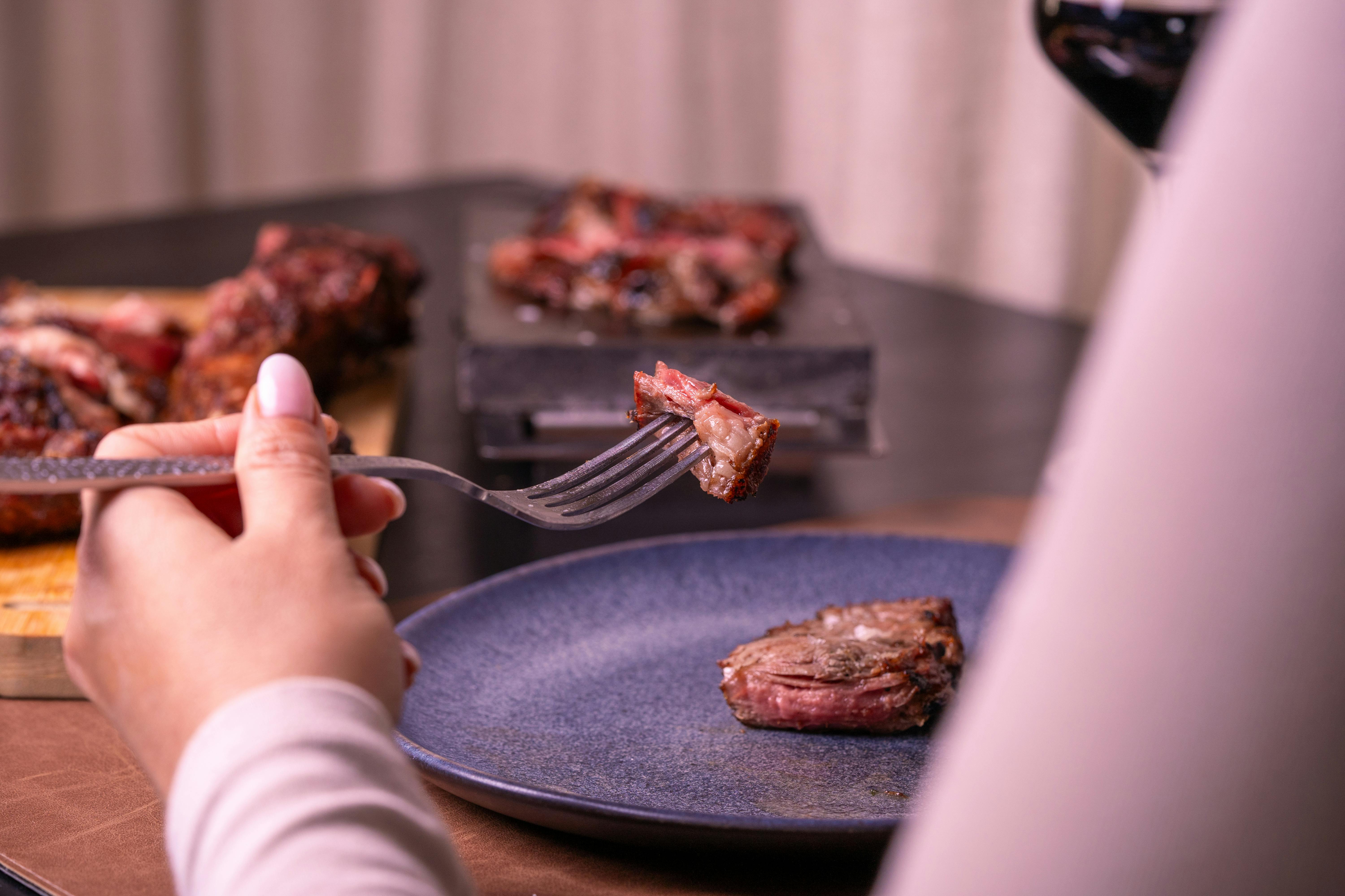 Close-up of Grilled Beef Steak on Dining Table · Free Stock Photo