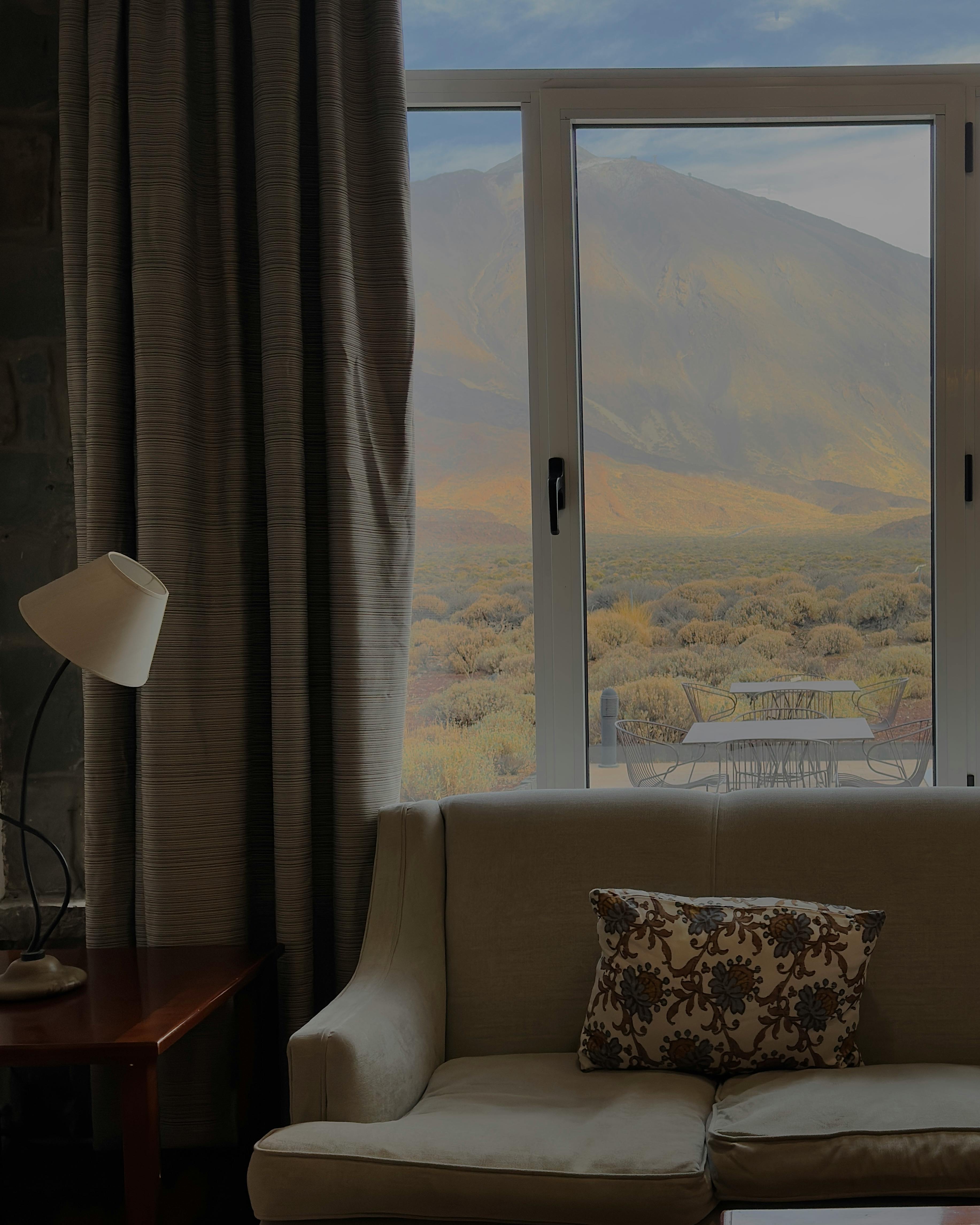 Cozy Interior with Mountain View through Window · Free Stock Photo