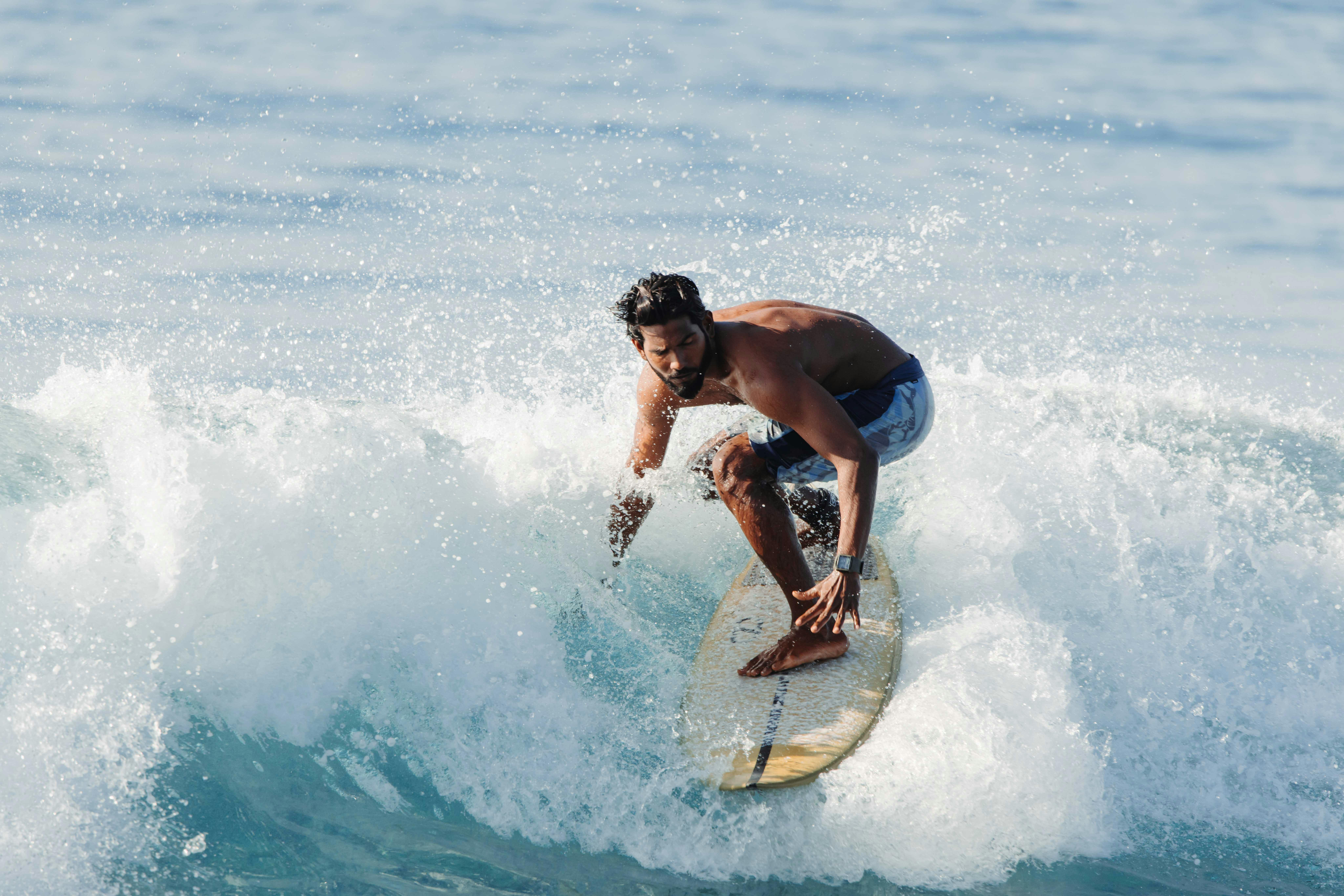 Surfer Riding Waves in the Maldives · Free Stock Photo