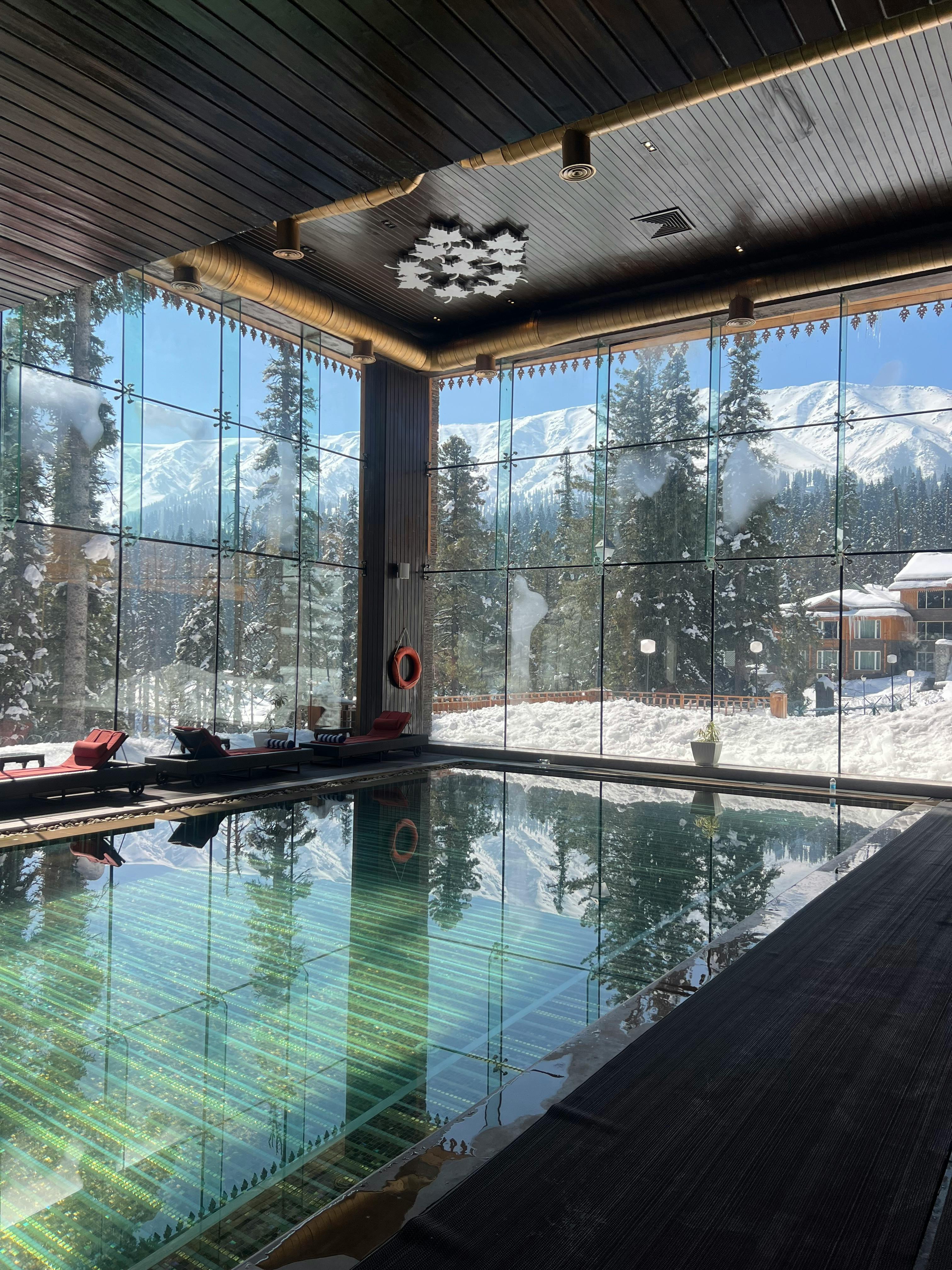 Luxurious Indoor Pool with Snowy Mountain View · Free Stock Photo