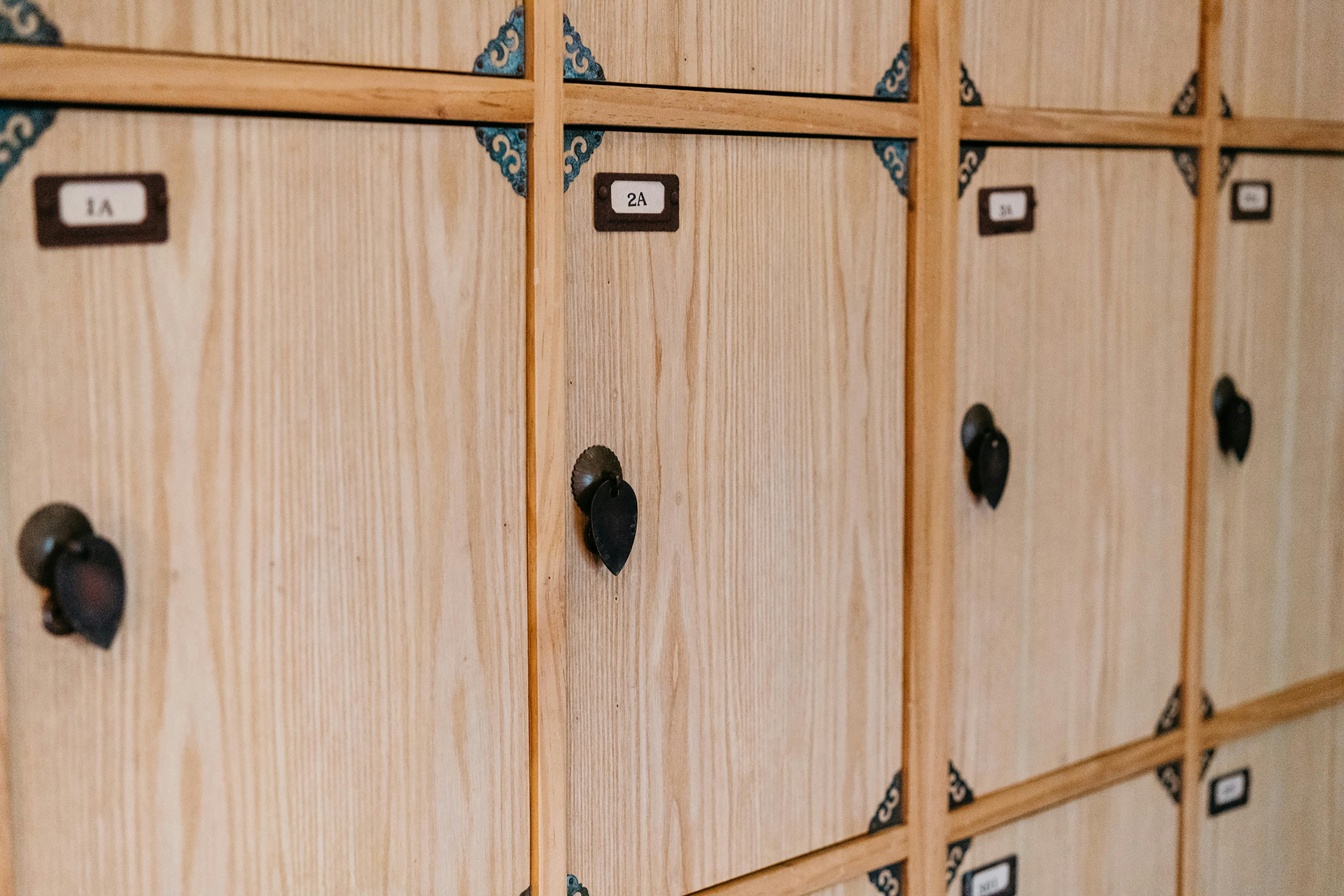 Elegant Wooden Lockers with Heart-Shaped Handles · Free Stock Photo