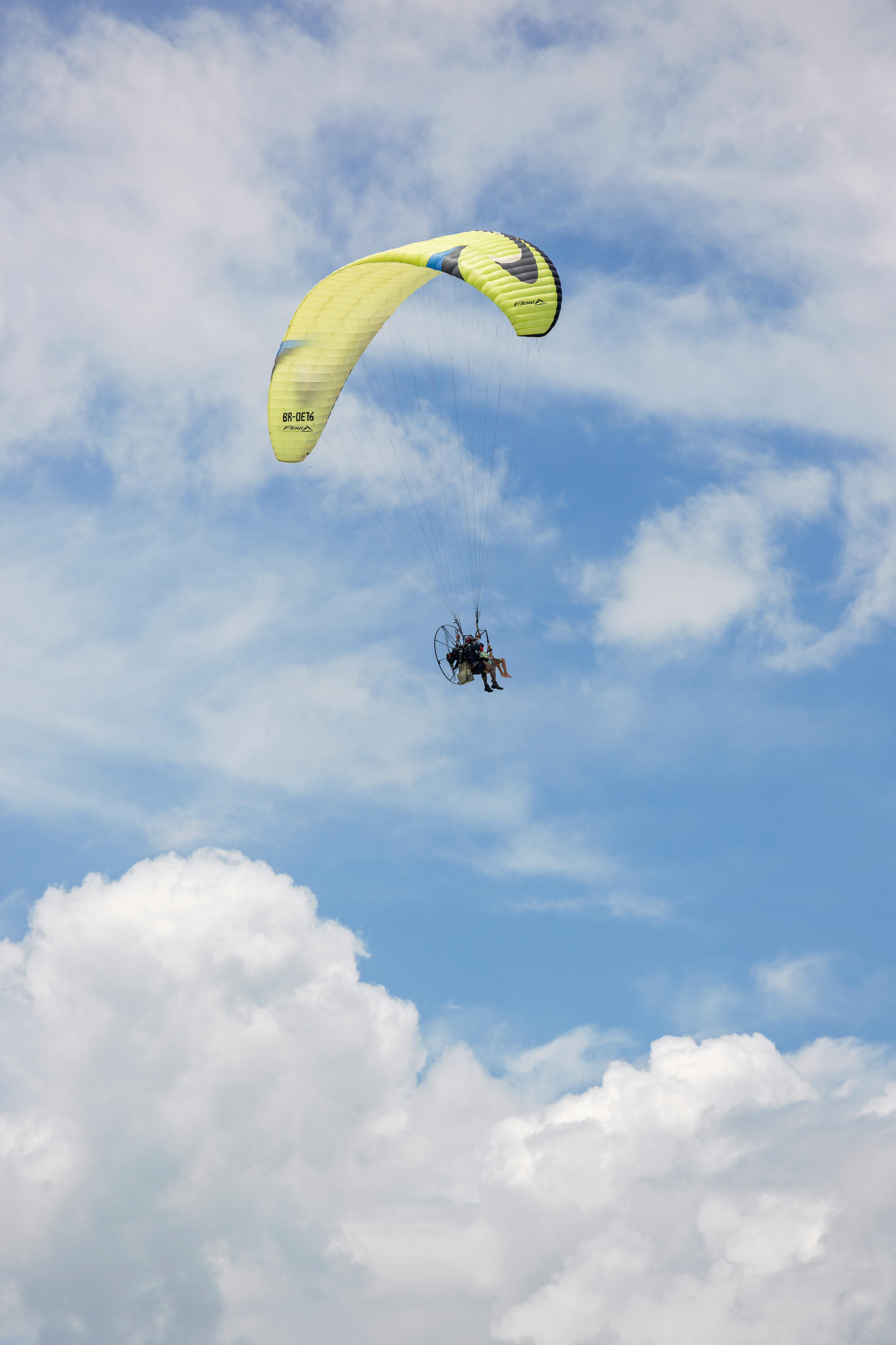 Low Angle View of Paragliding Against Sky · Free Stock Photo