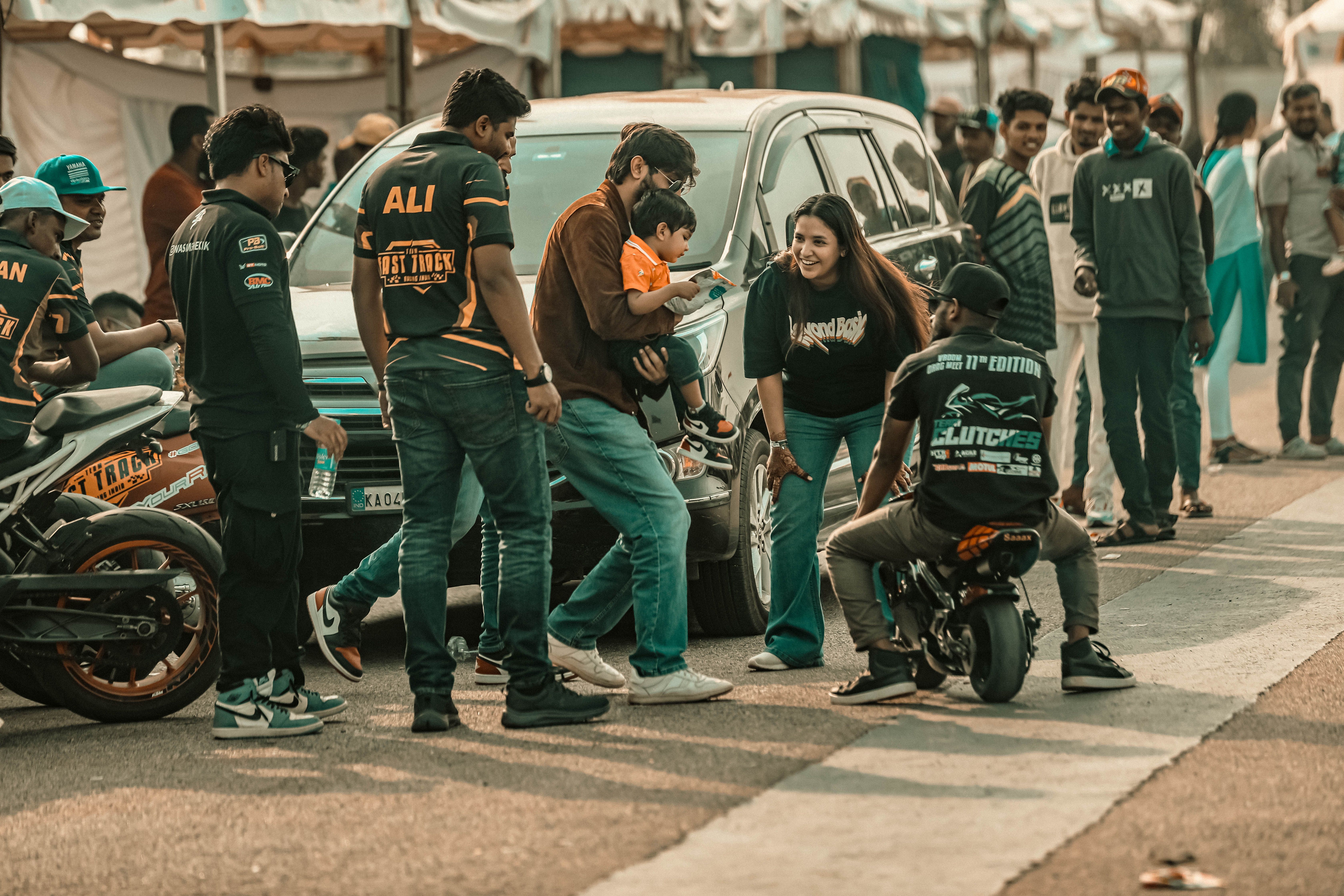 Exciting Racing Event with Enthusiastic Crowd · Free Stock Photo