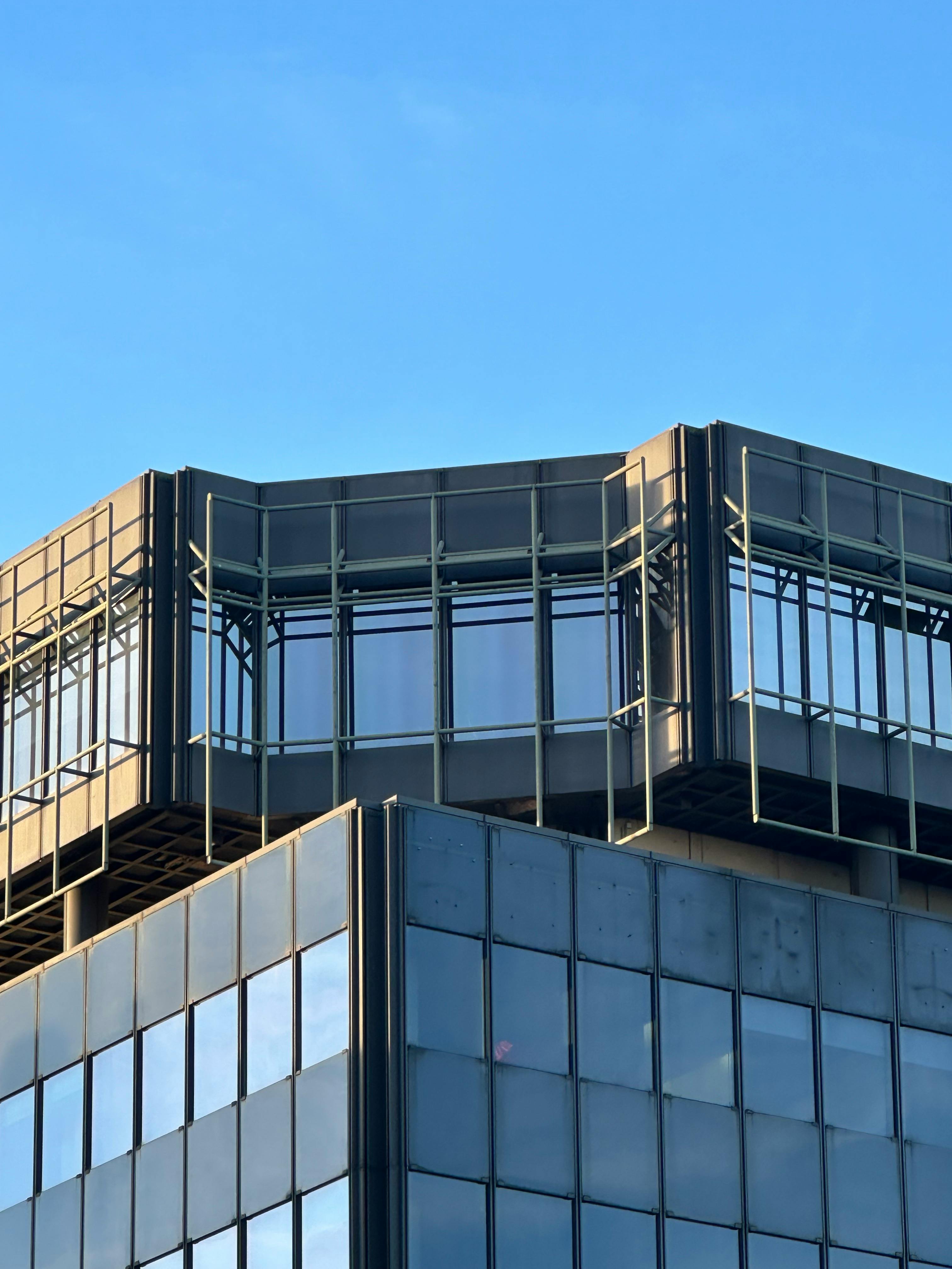 Modern Glass Skyscraper Corner against Blue Sky · Free Stock Photo