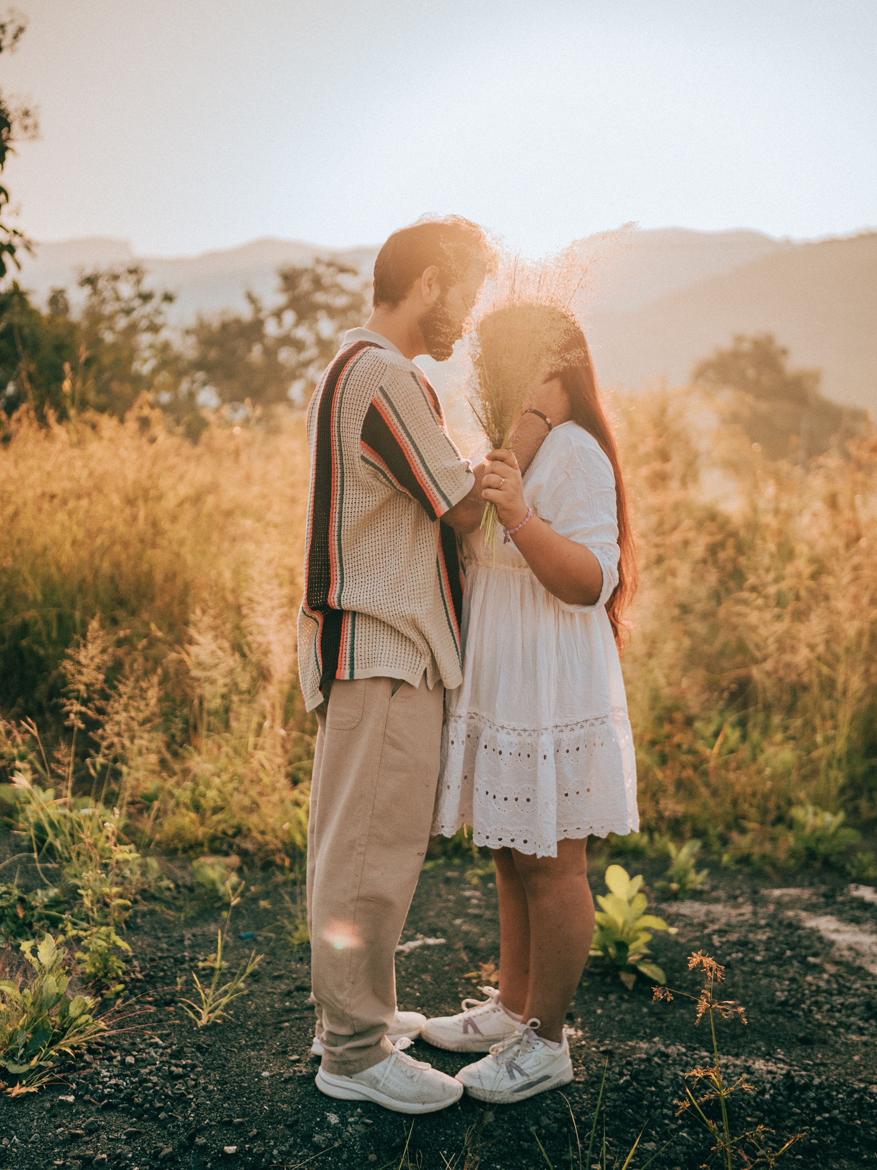 Romantic Couple in Nature During Sunset · Free Stock Photo