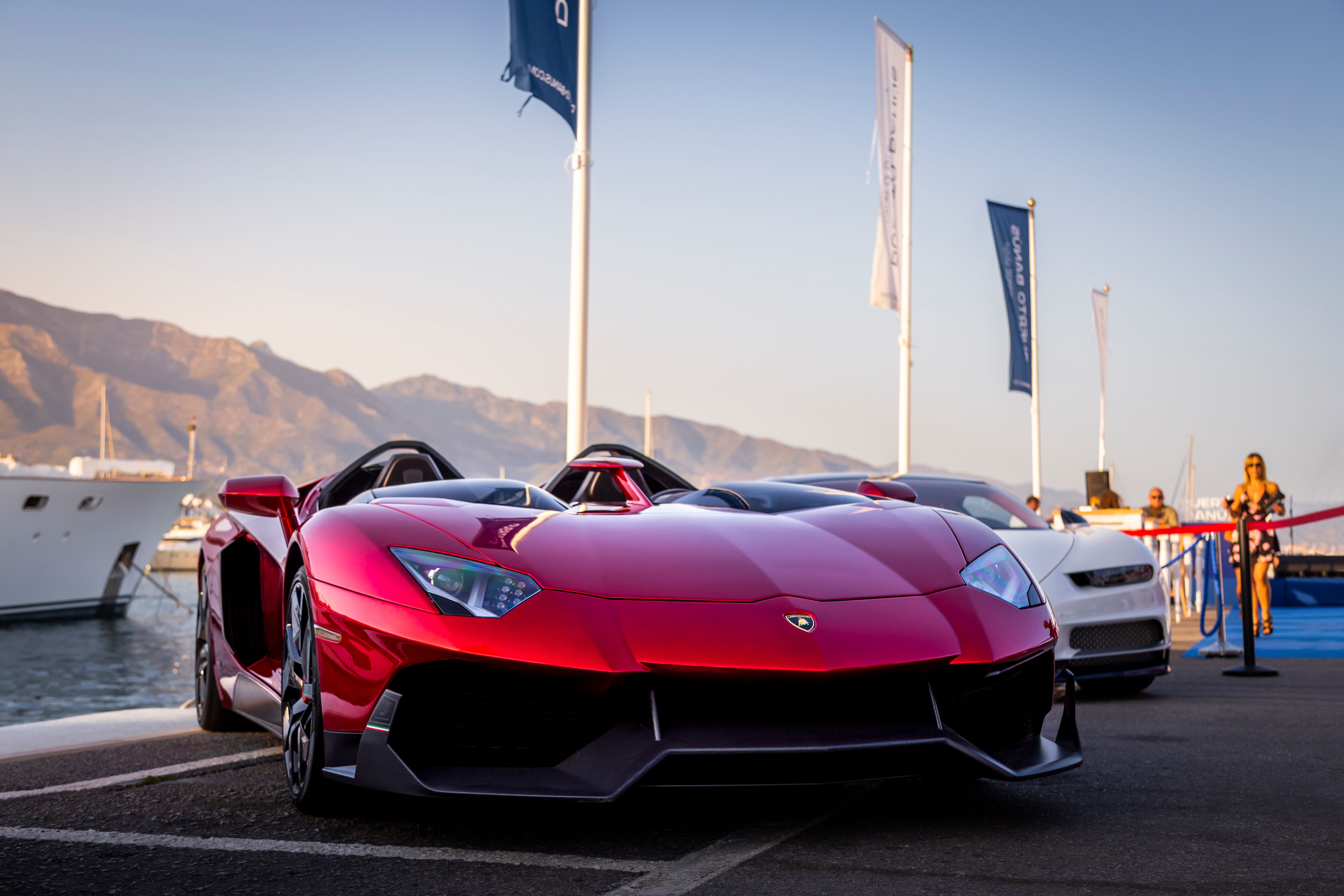 Red Supercar at Sunset by Marbella Marina · Free Stock Photo