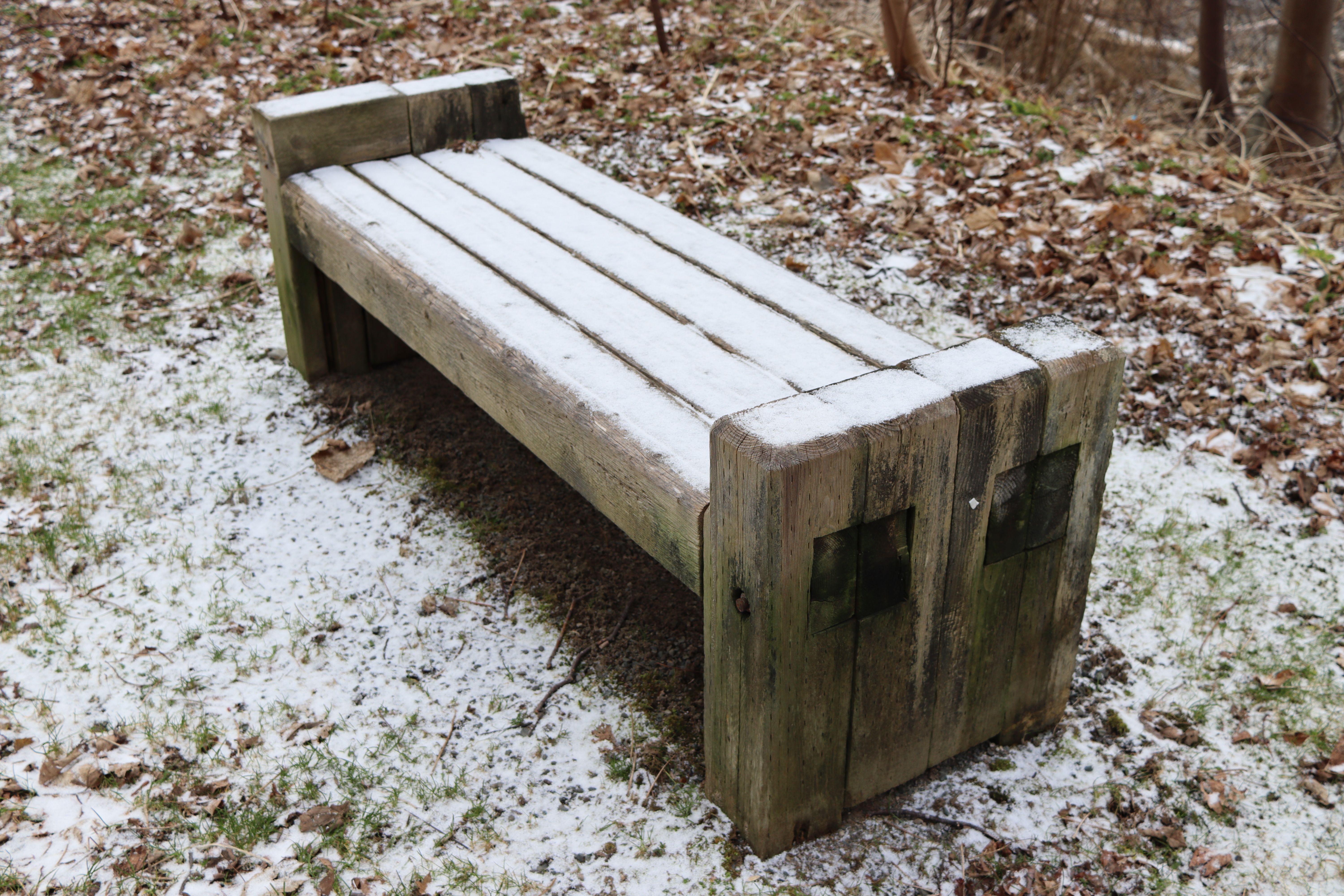 Snow-Covered Wooden Bench in Winter Forest · Free Stock Photo