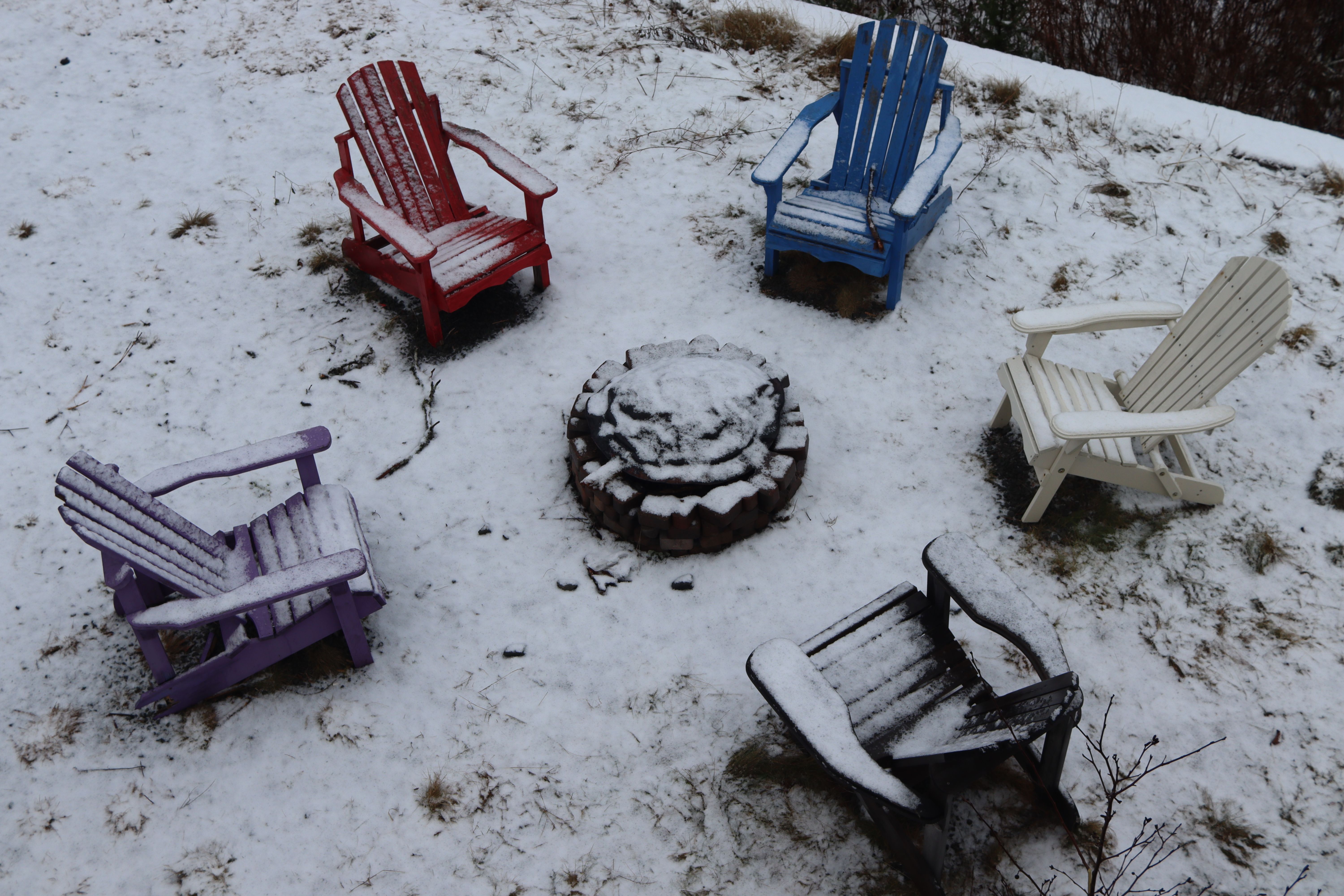 Winter Snowfall on Colorful Adirondack Chairs · Free Stock Photo