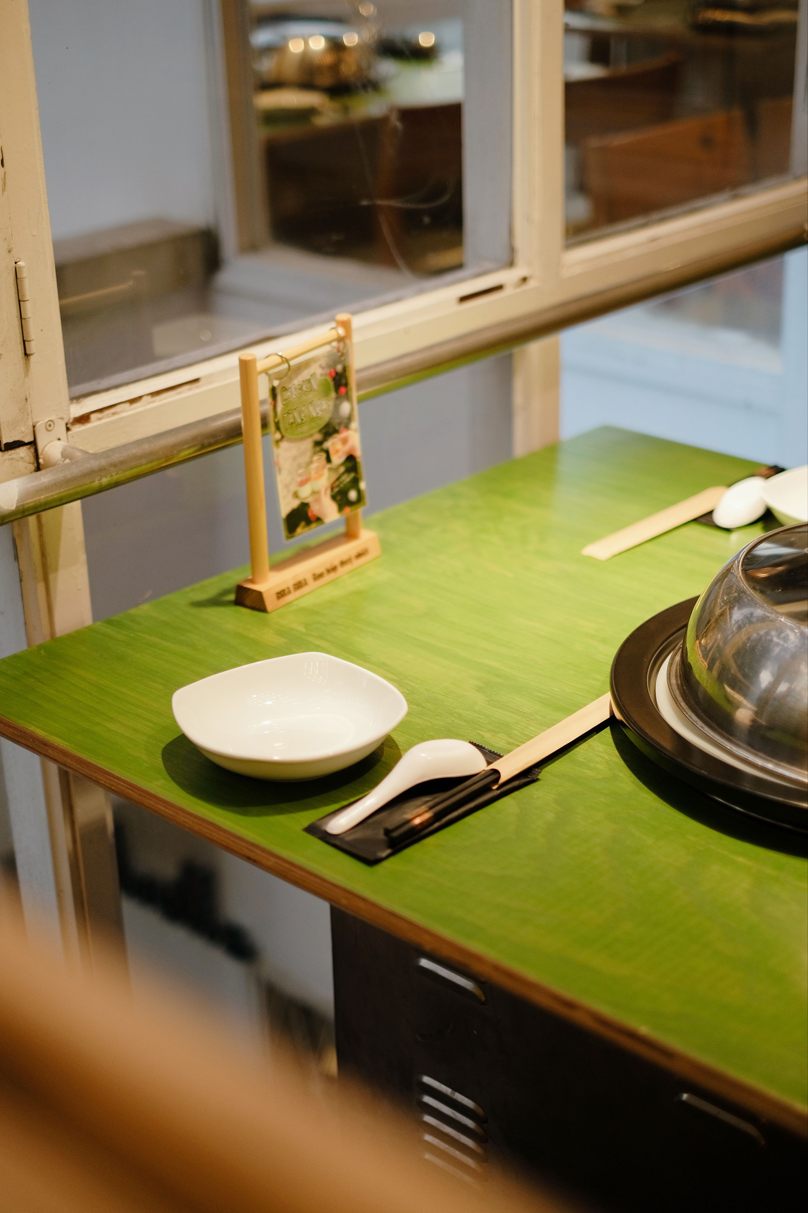 Cozy Restaurant Table with Green Surface Setting · Free Stock Photo