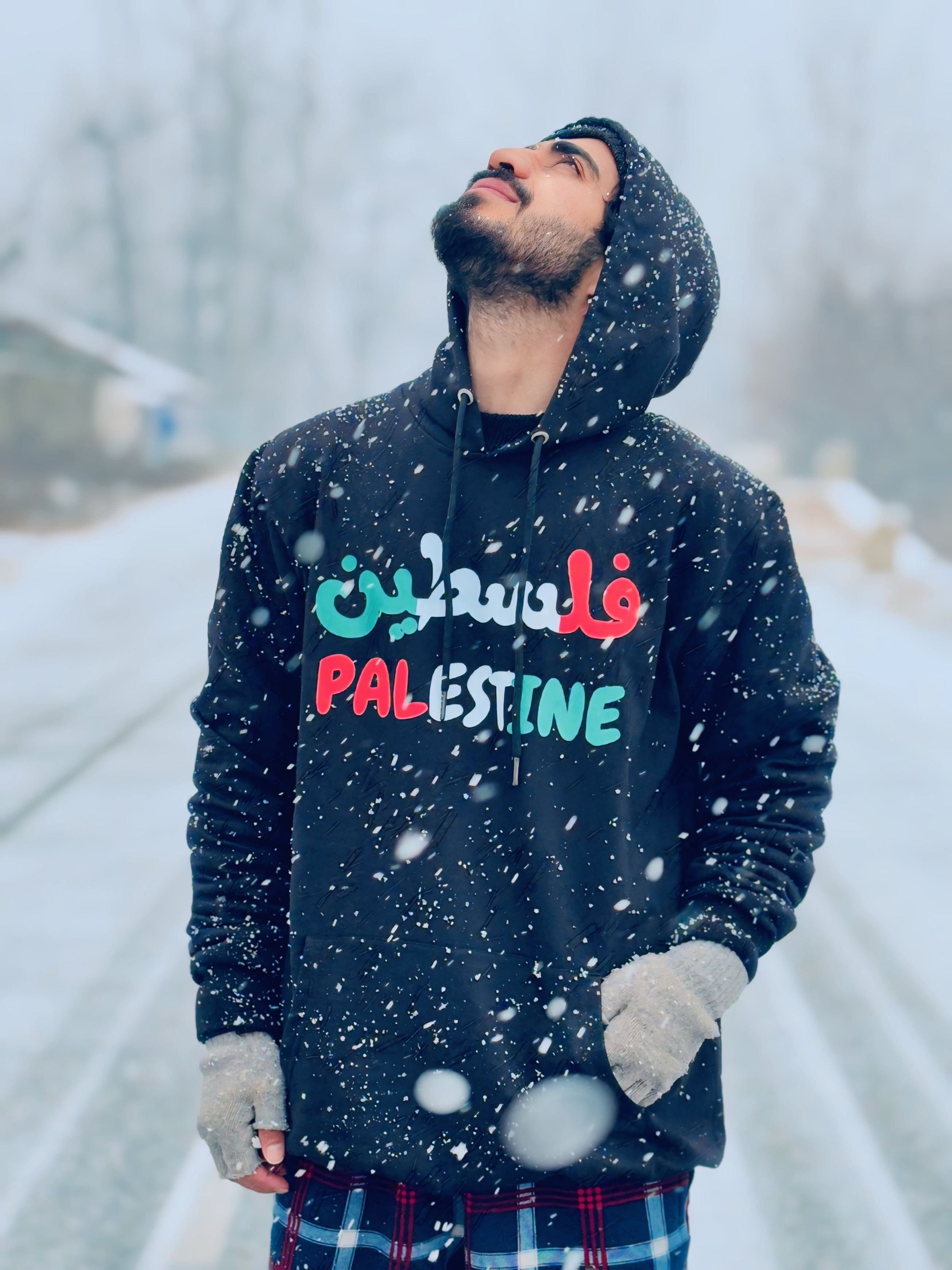 Person Enjoying Winter Snowfall in Palestine · Free Stock Photo