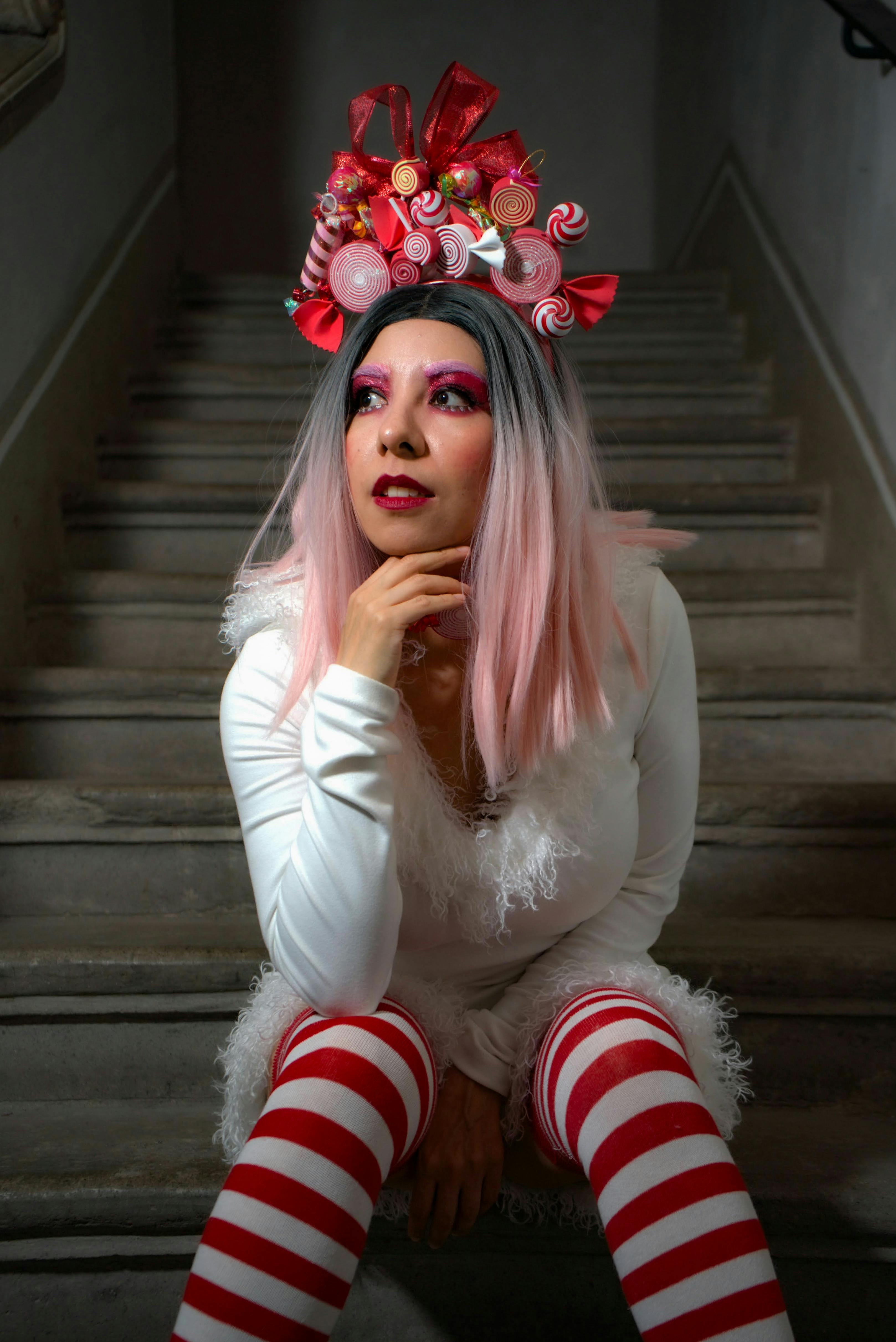 Festive Candy-Themed Costume on Stairway · Free Stock Photo