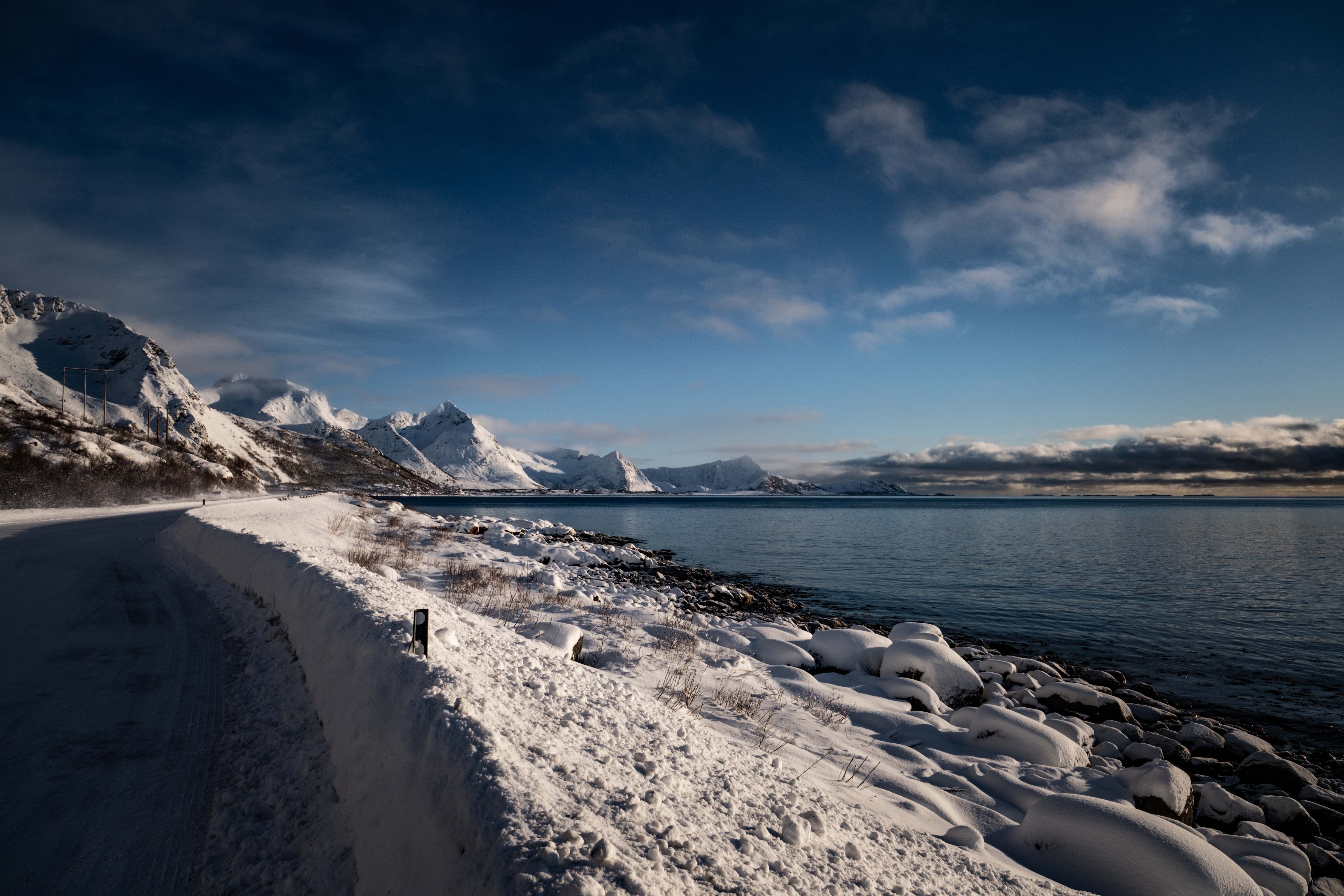 Scenic Snowy Coastal Road in Winter Landscape · Free Stock Photo