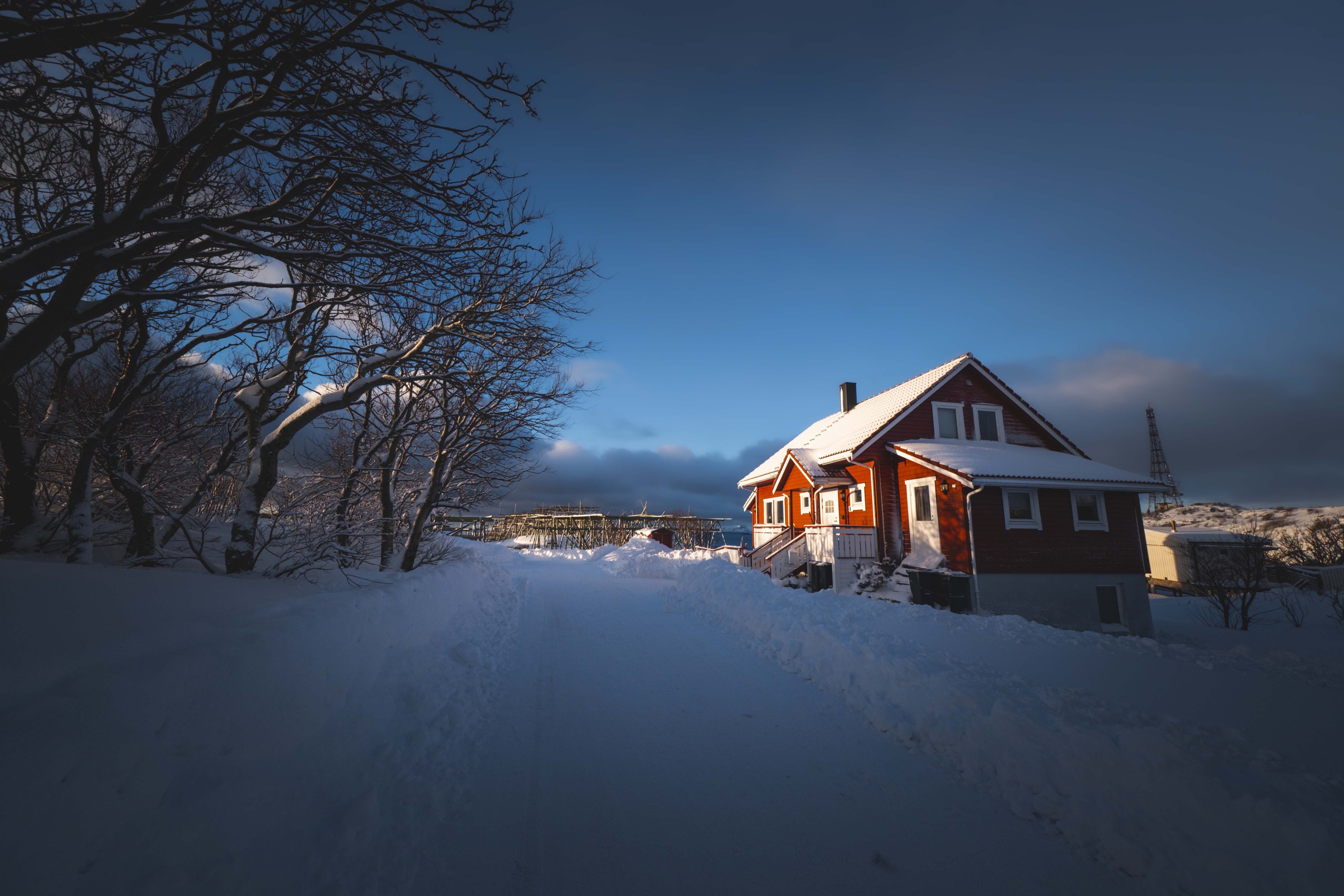 Scenic Winter Landscape with Red House at Dusk · Free Stock Photo