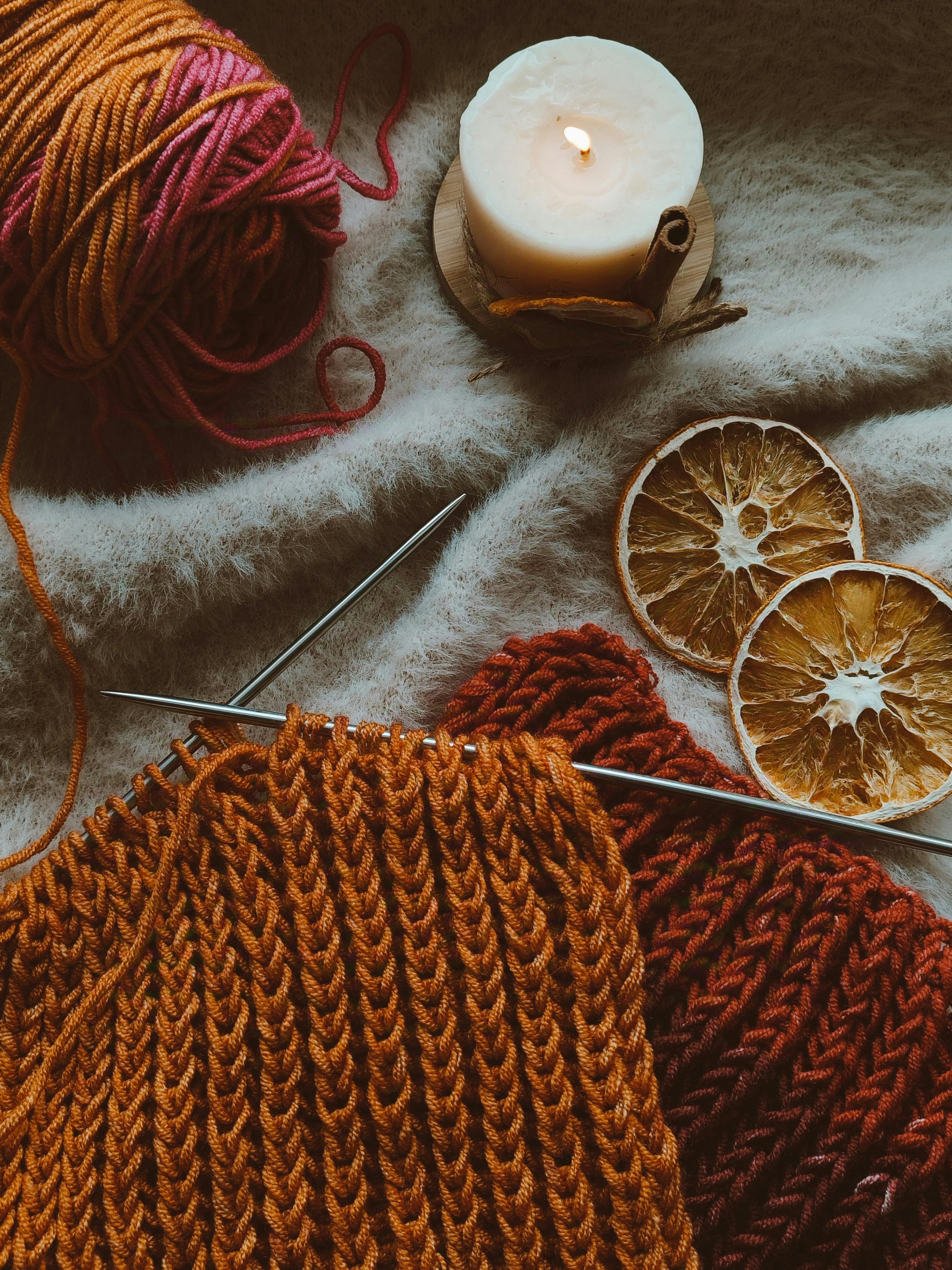 Cozy Autumn Knitting Scene with Candle Light · Free Stock Photo