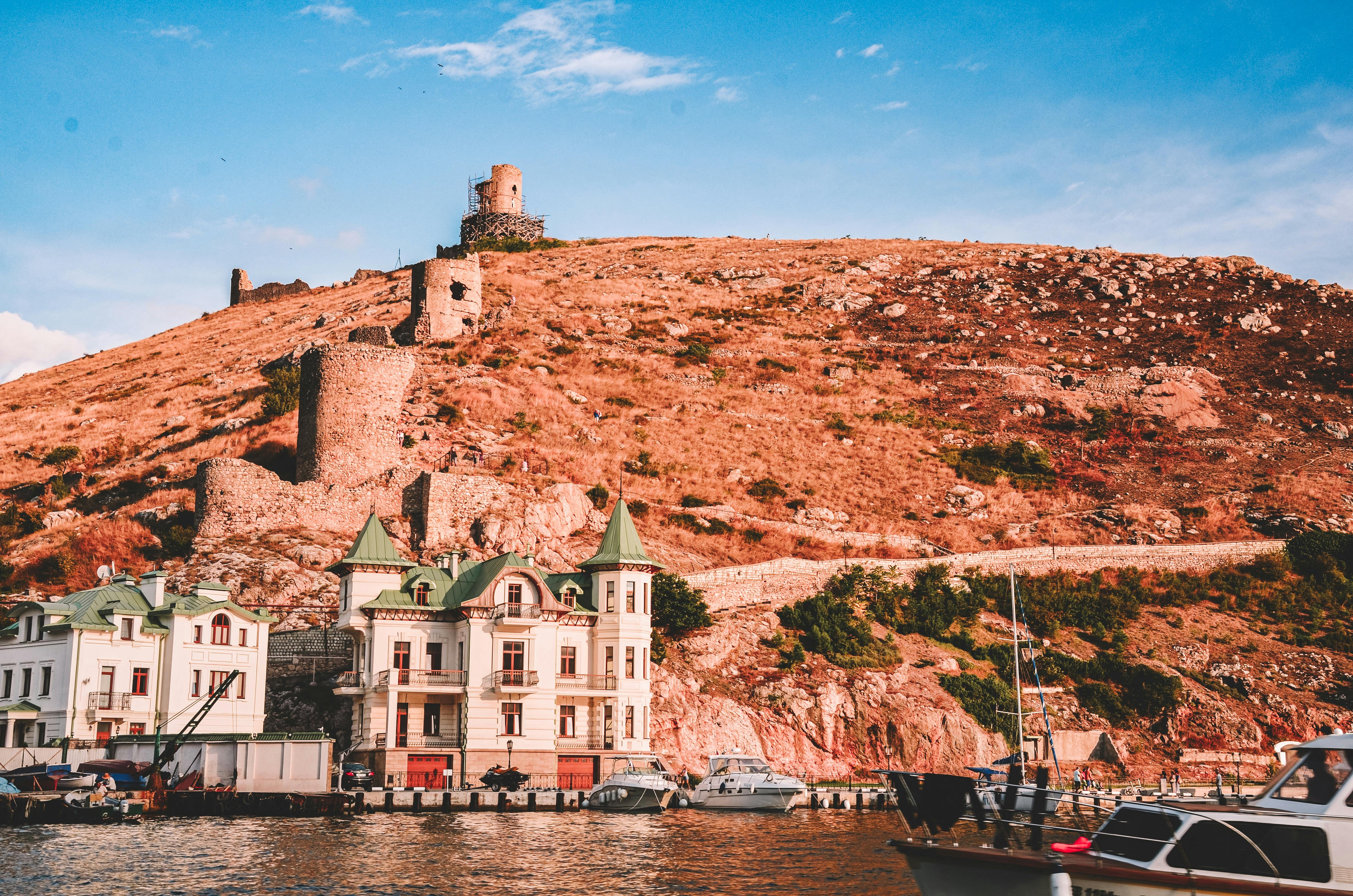 Historic Castle Ruins Above Seaside Village · Free Stock Photo