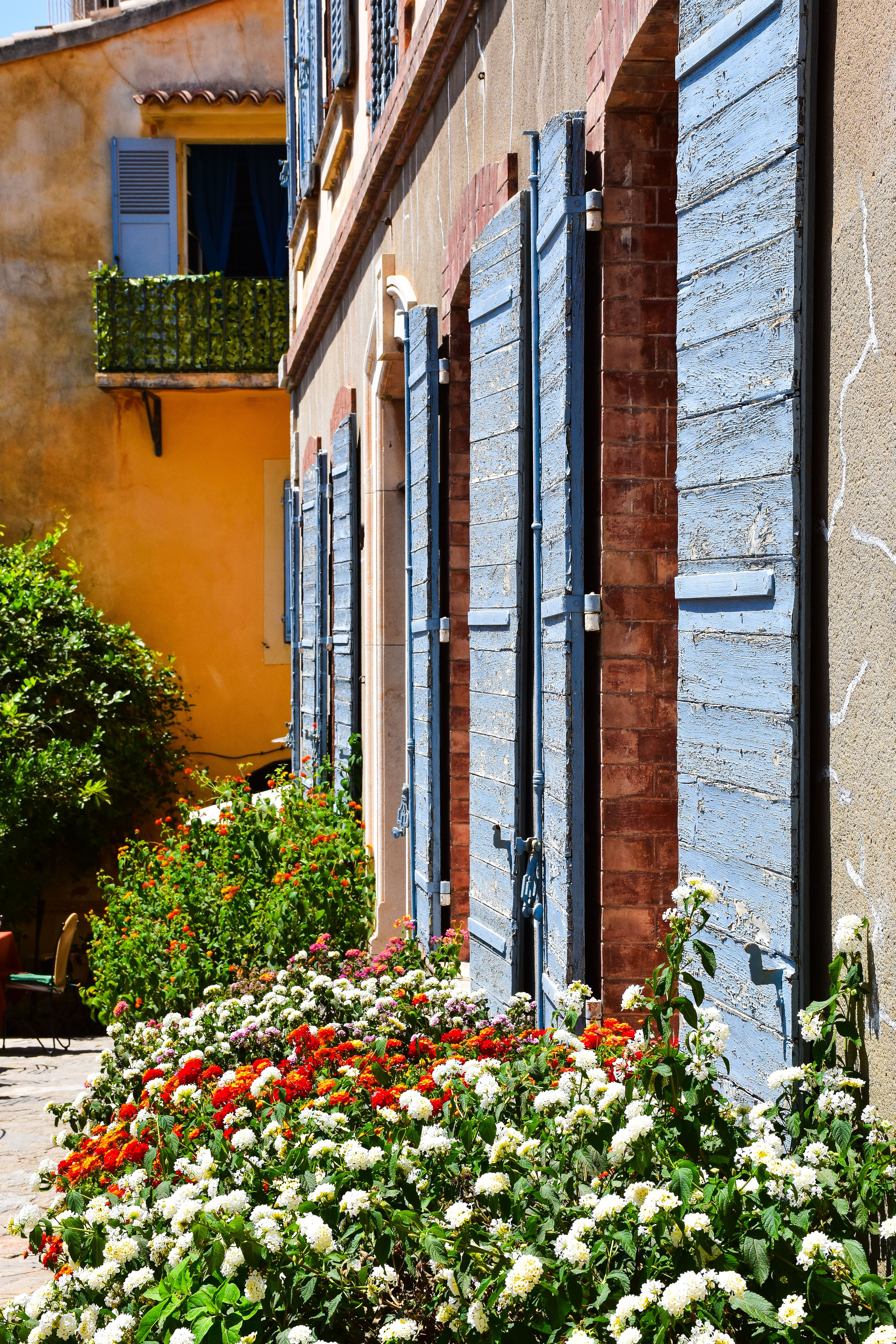 Charming French Village Street with Colorful Shutters · Free Stock Photo