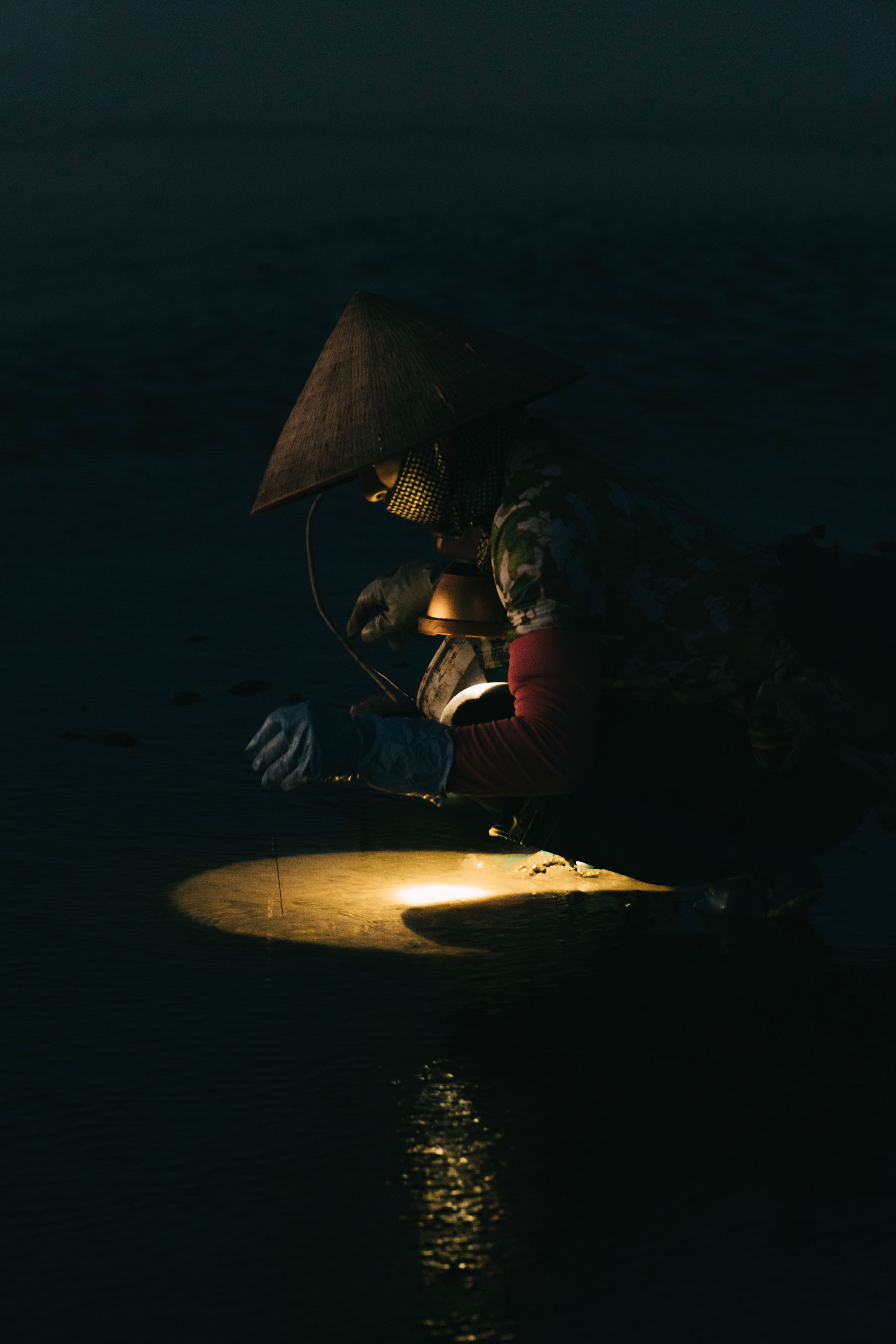 Traditional Nighttime Fishing with Lantern · Free Stock Photo