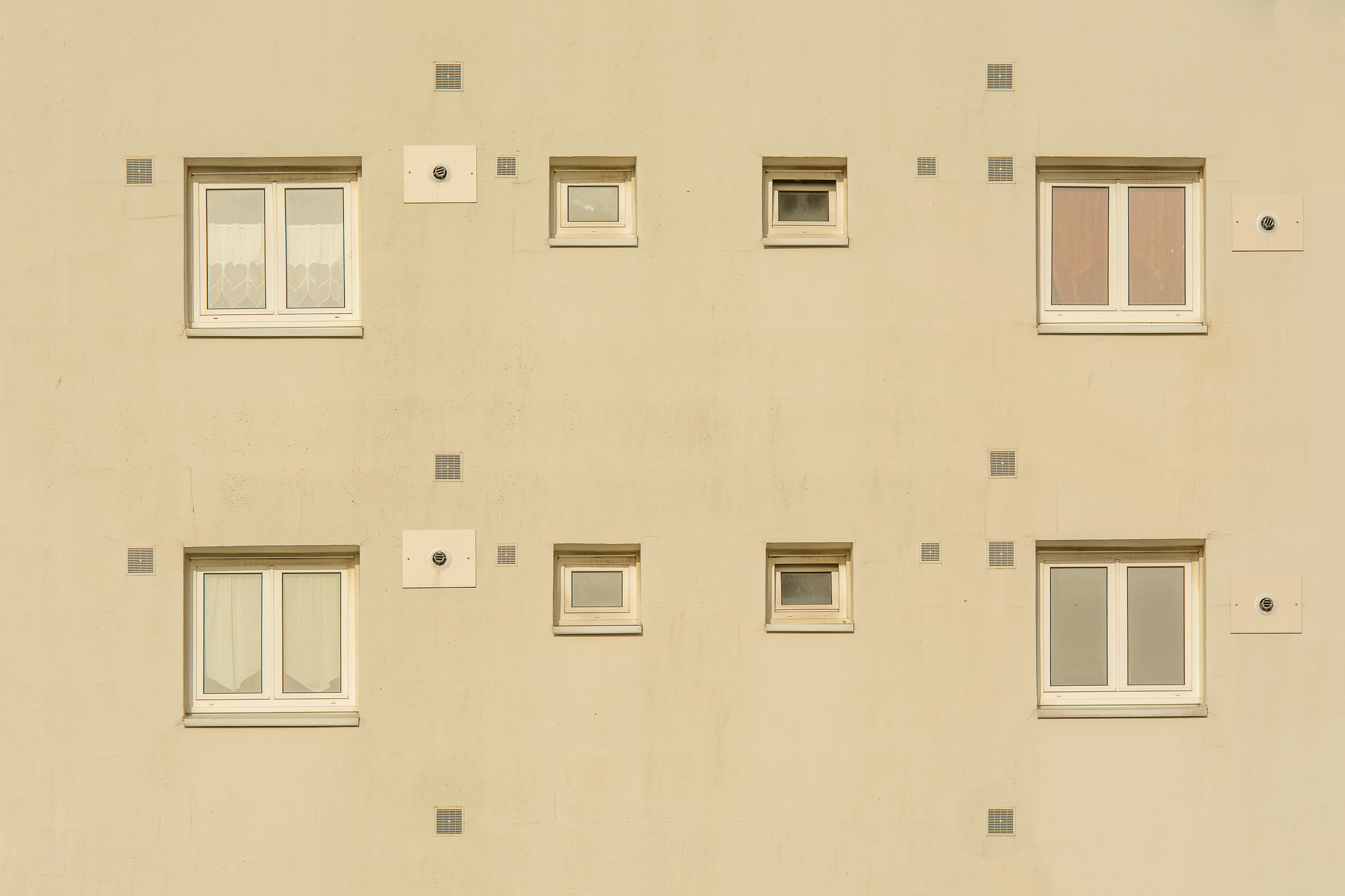 Symmetrical Building Facade with Windows · Free Stock Photo