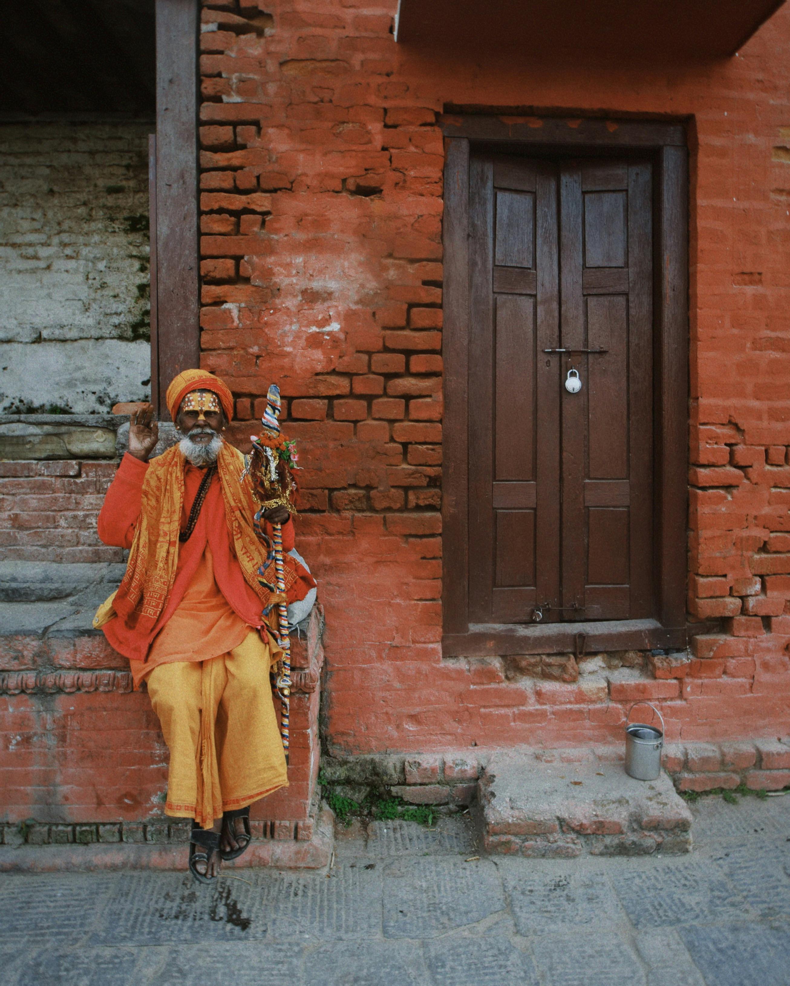 Monk in Traditional Robes in Authentic Setting · Free Stock Photo