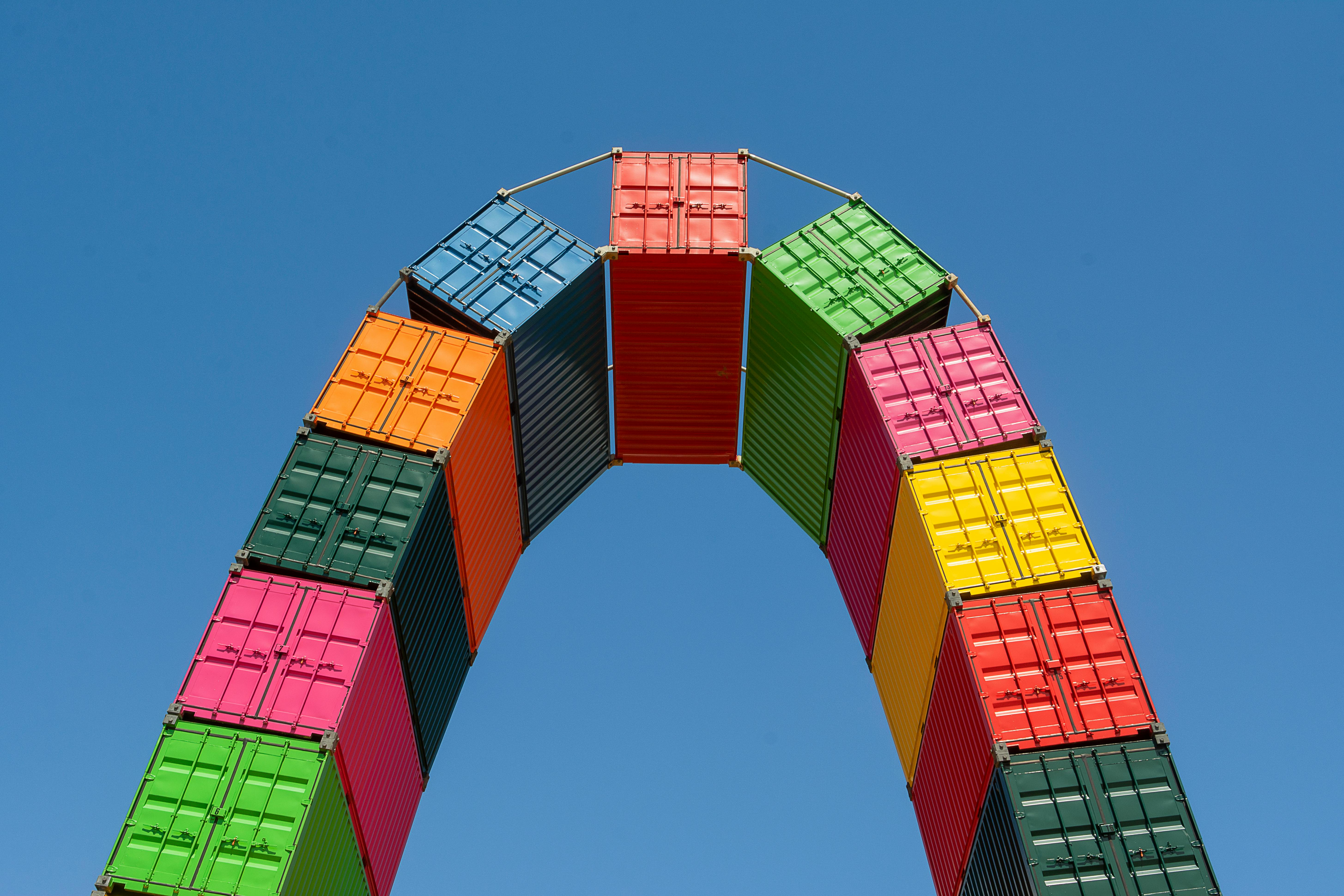 Colorful Shipping Container Arch against Blue Sky · Free Stock Photo