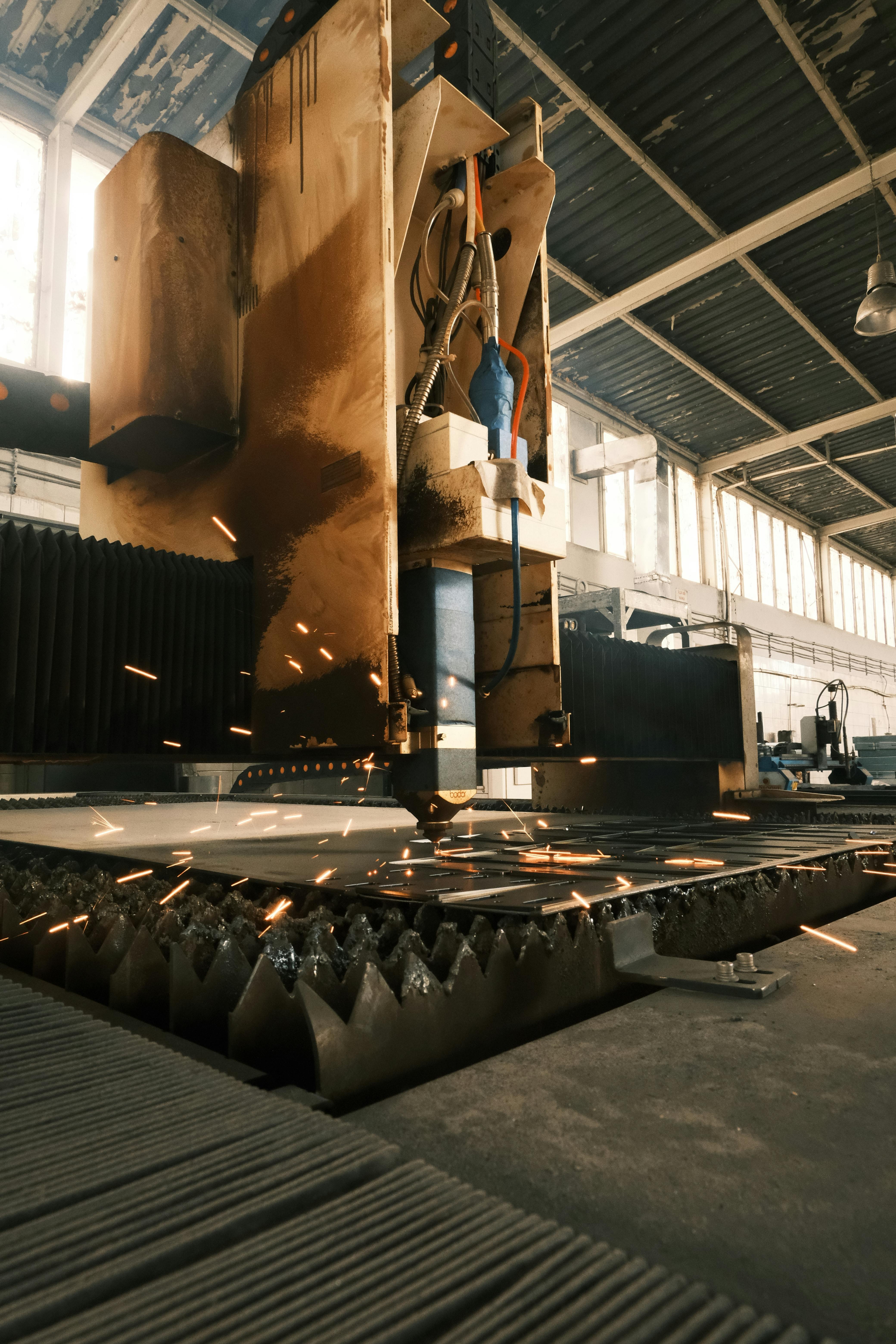 Modern Laser Cutter in Industrial Environment · Free Stock Photo