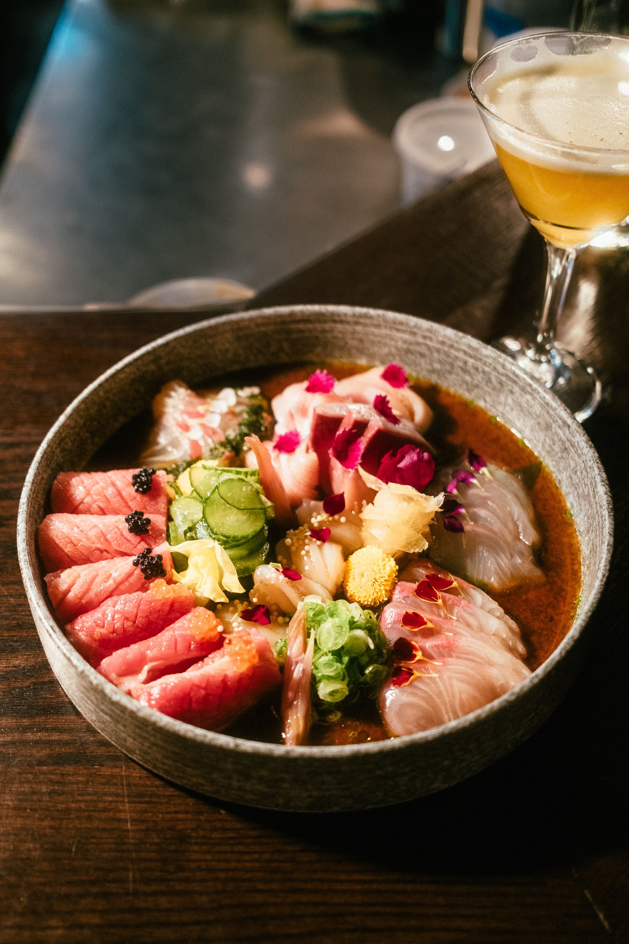 Exquisite Sushi Bowl with Fresh Sashimi and Cocktail · Free Stock Photo