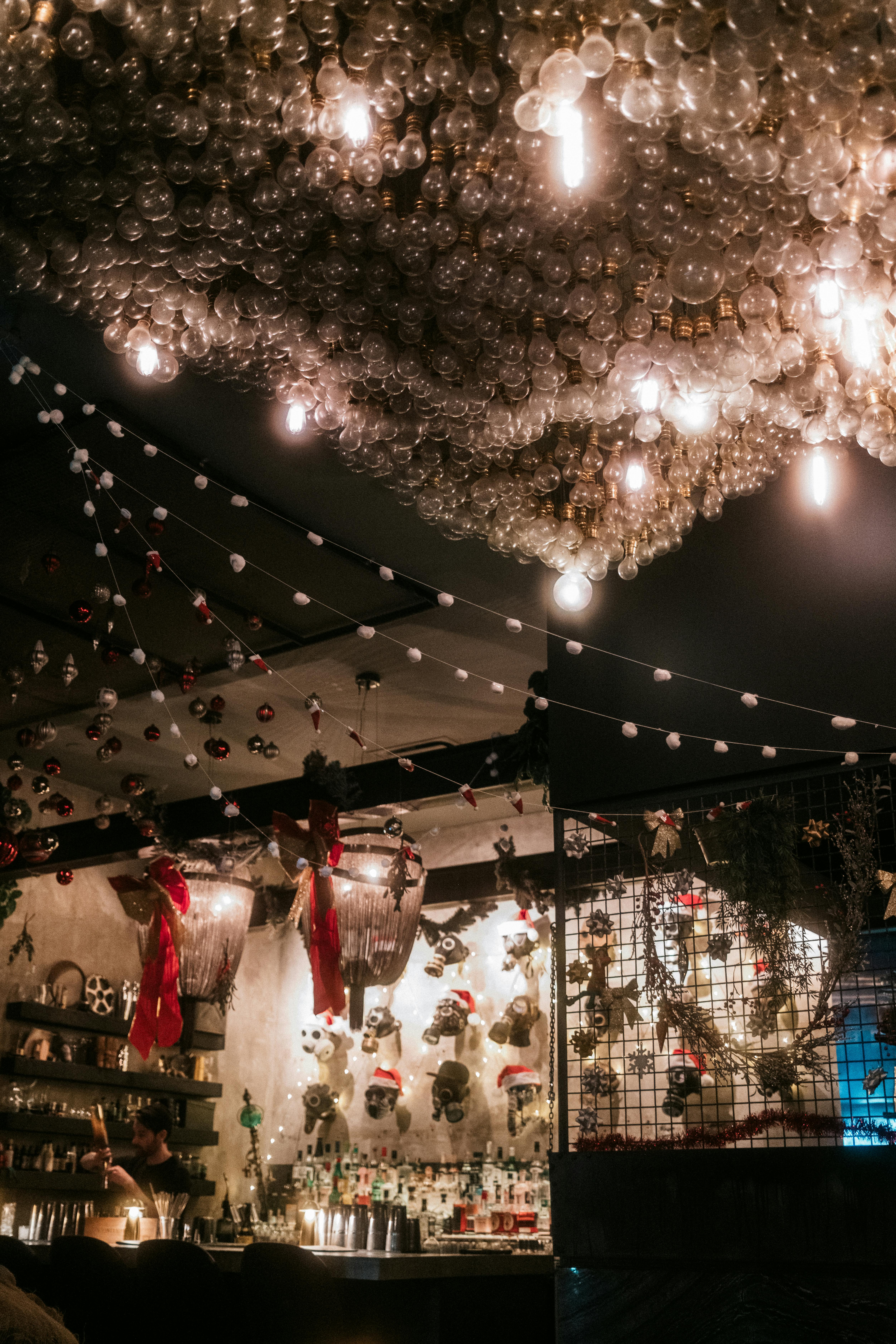 Festive Christmas Bar with Ornate Ceiling Decor · Free Stock Photo
