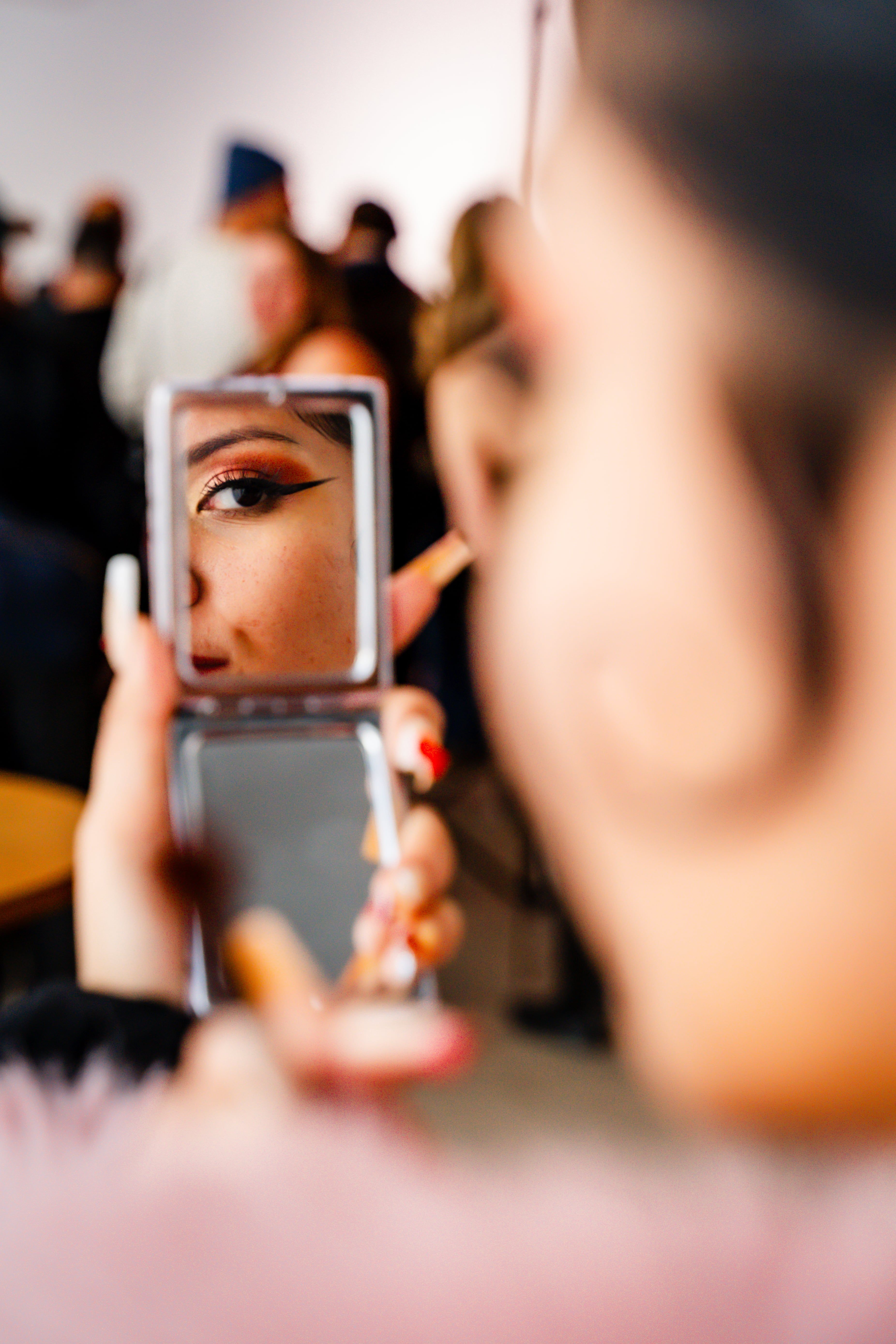 Mirror Reflection of Woman Applying Makeup · Free Stock Photo