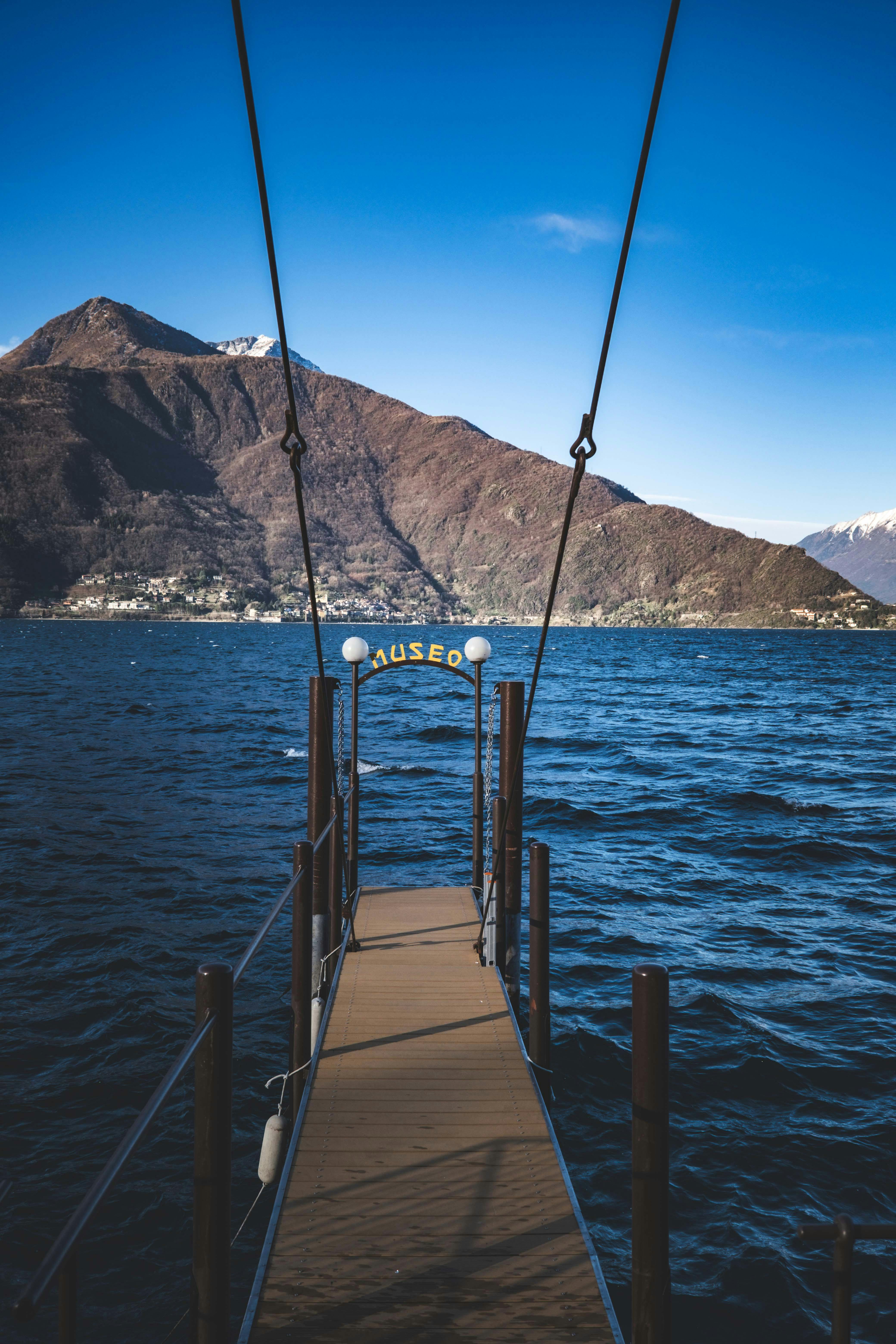 Scenic Dock Overlooking Tranquil Lake and Mountains · Free Stock Photo