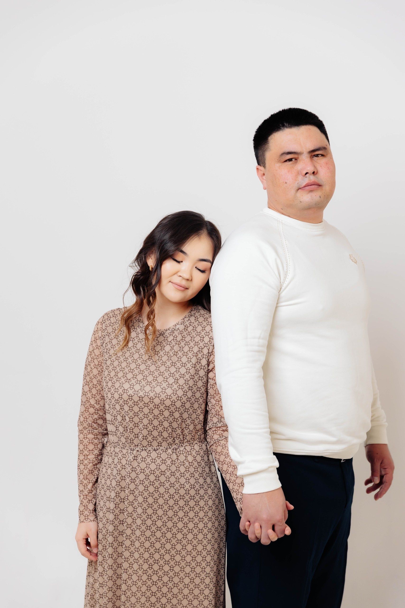 Heartfelt Couple Portrait in Minimalist Setting · Free Stock Photo
