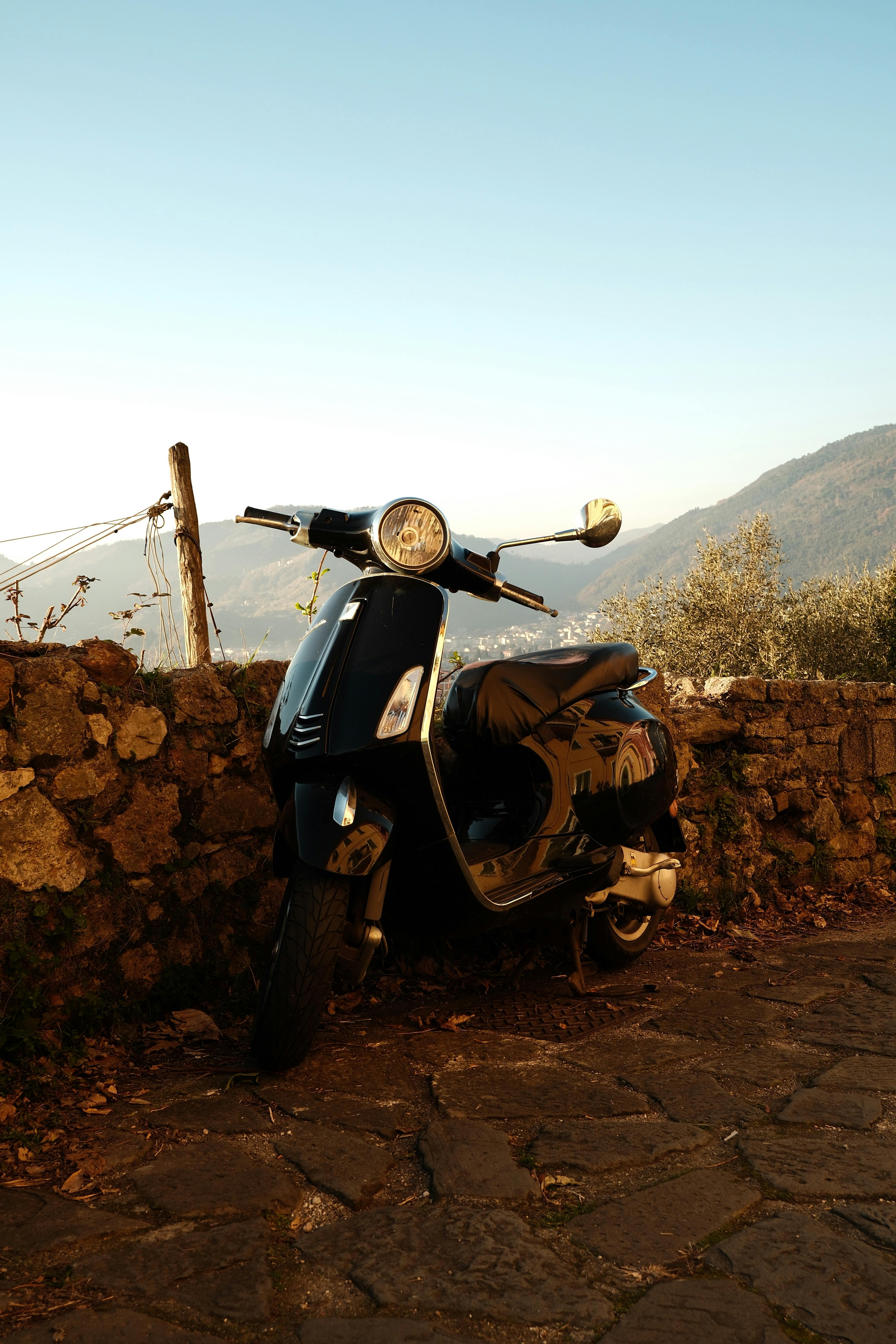 Classic Vespa Scooter in Scenic Tuscan Landscape · Free Stock Photo