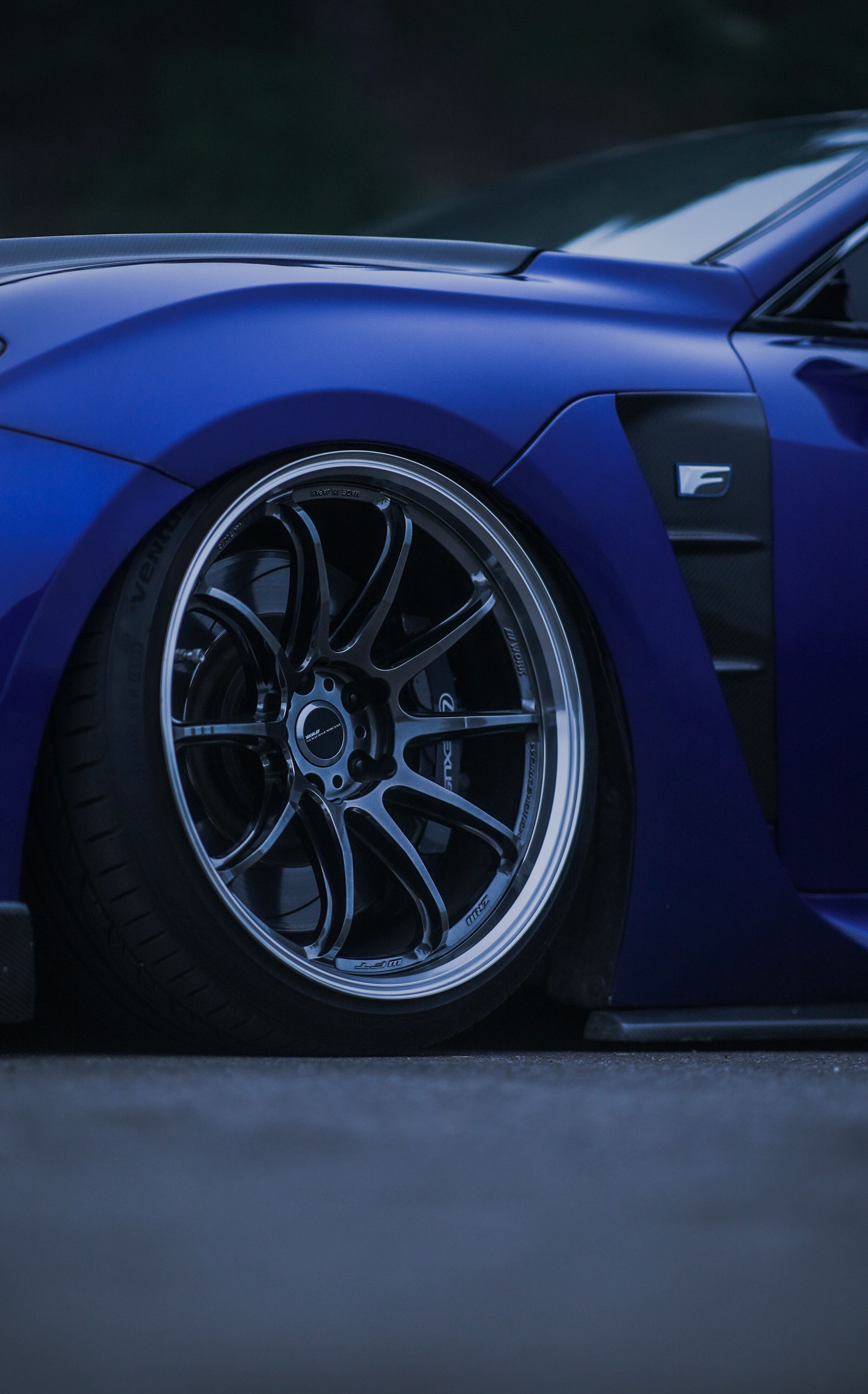 Close-up of Blue Sports Car Wheel Rim Detailing · Free Stock Photo