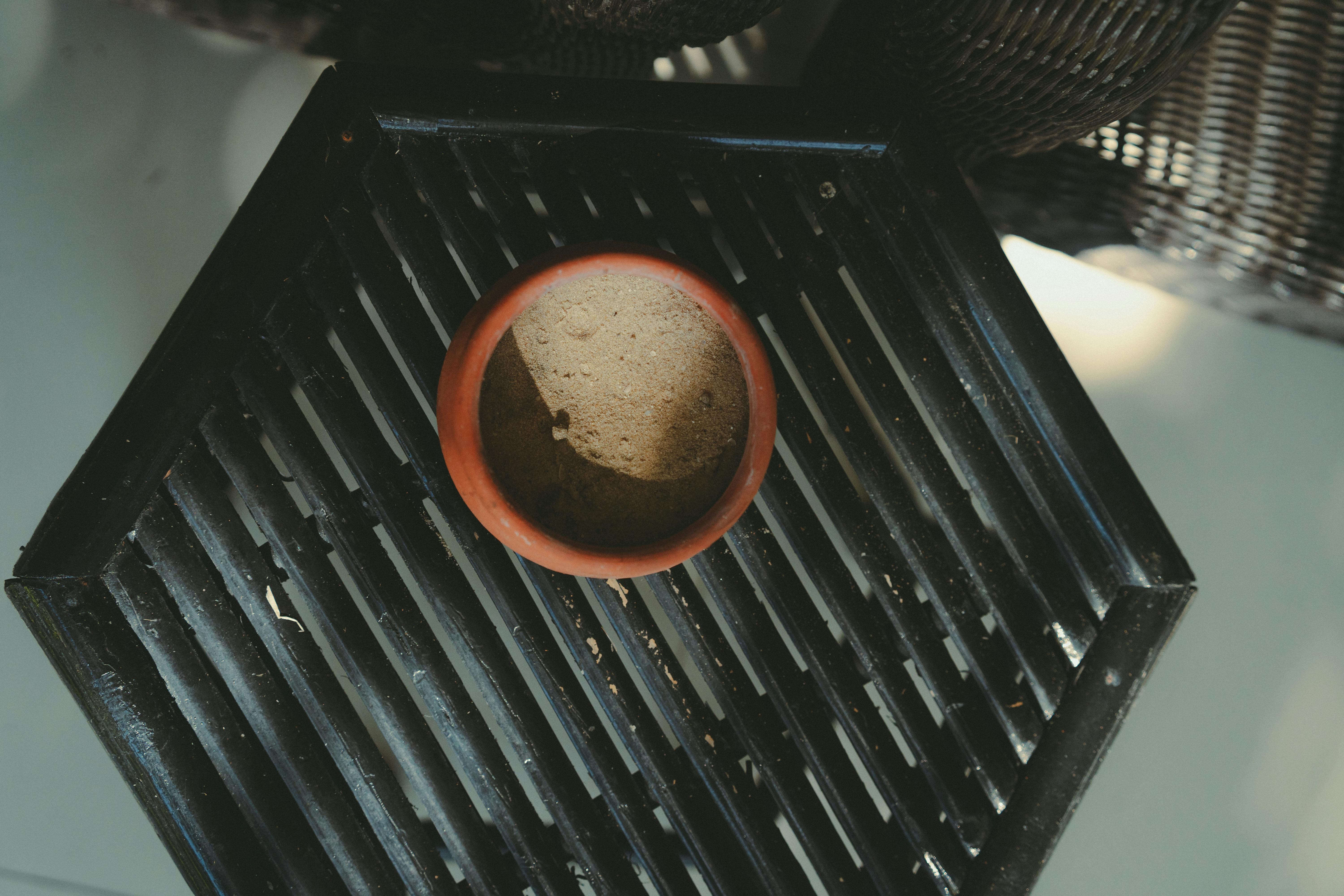 Minimalist View of Clay Pot on Hexagonal Table · Free Stock Photo