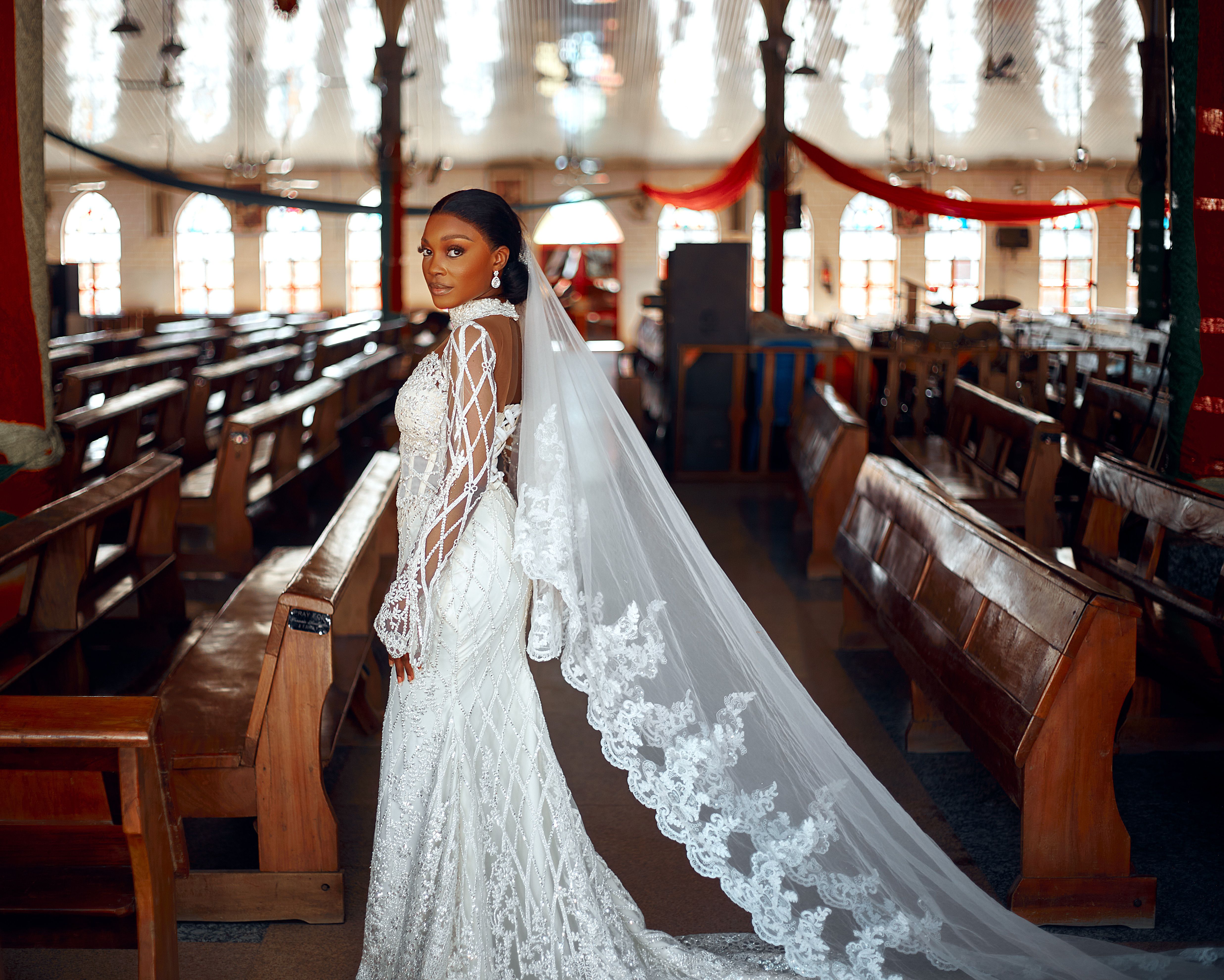 Elegant Bride in Church with Lace Veil · Free Stock Photo