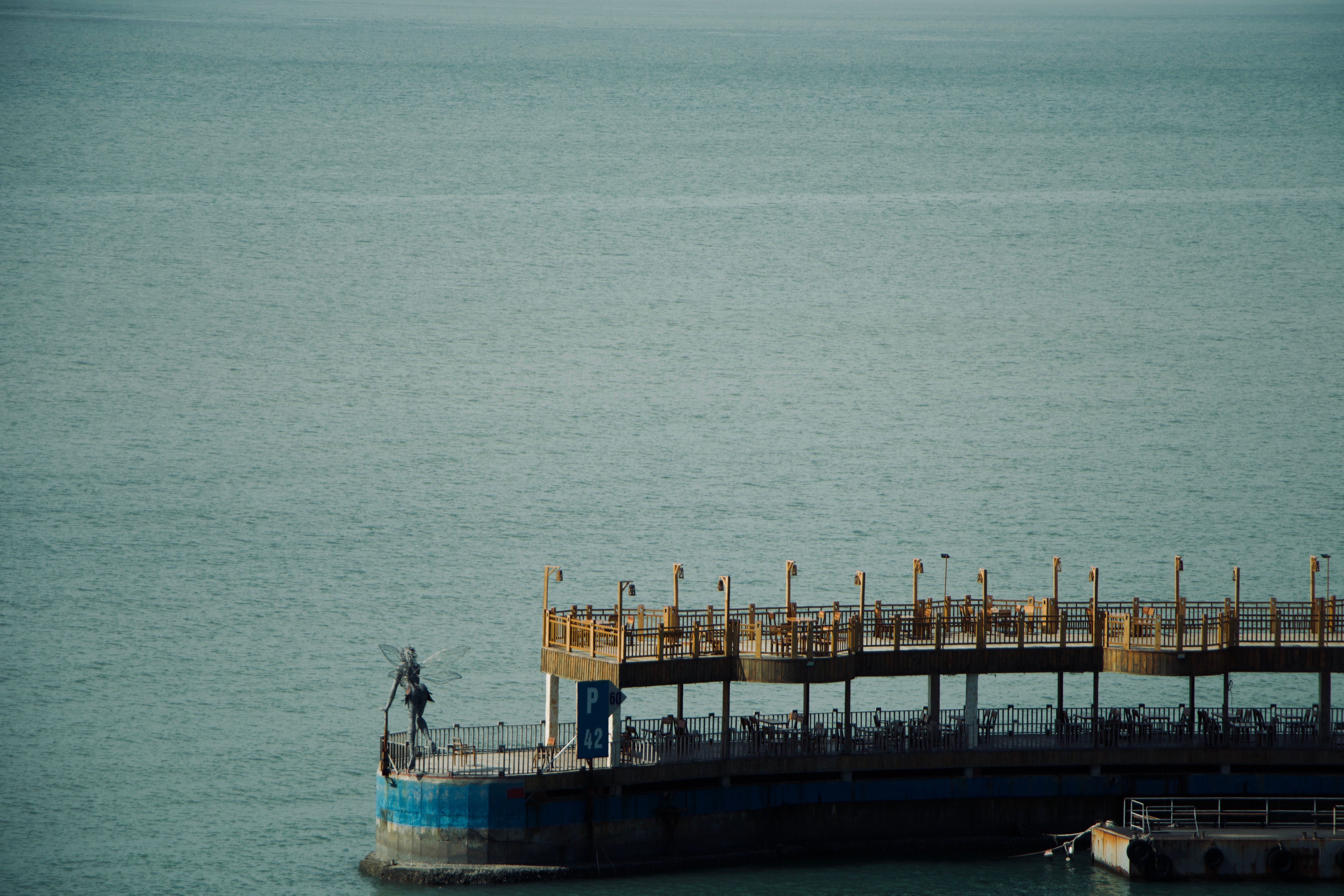 Scenic View of a Quiet Waterfront Pier · Free Stock Photo
