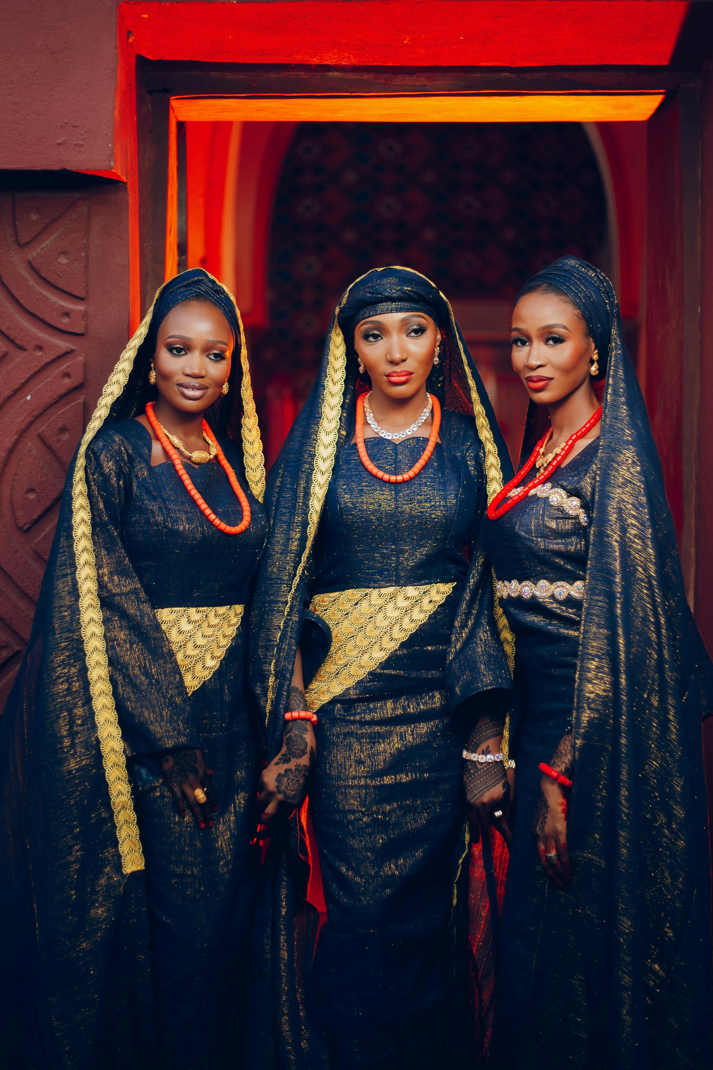 Elegant Portrait of Three Women in Traditional Attire · Free Stock Photo