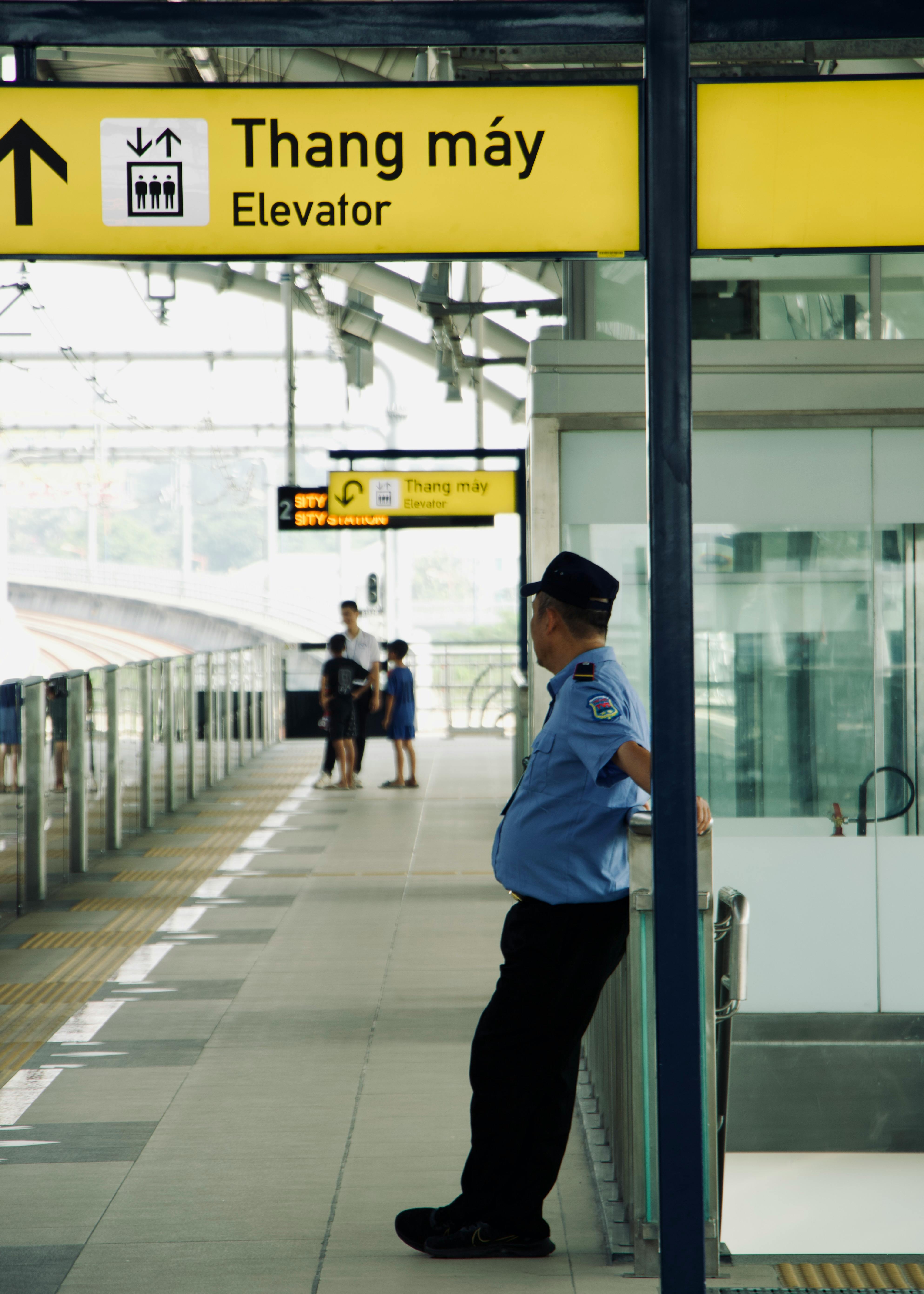 Security Guard at Metro Station Gateway · Free Stock Photo