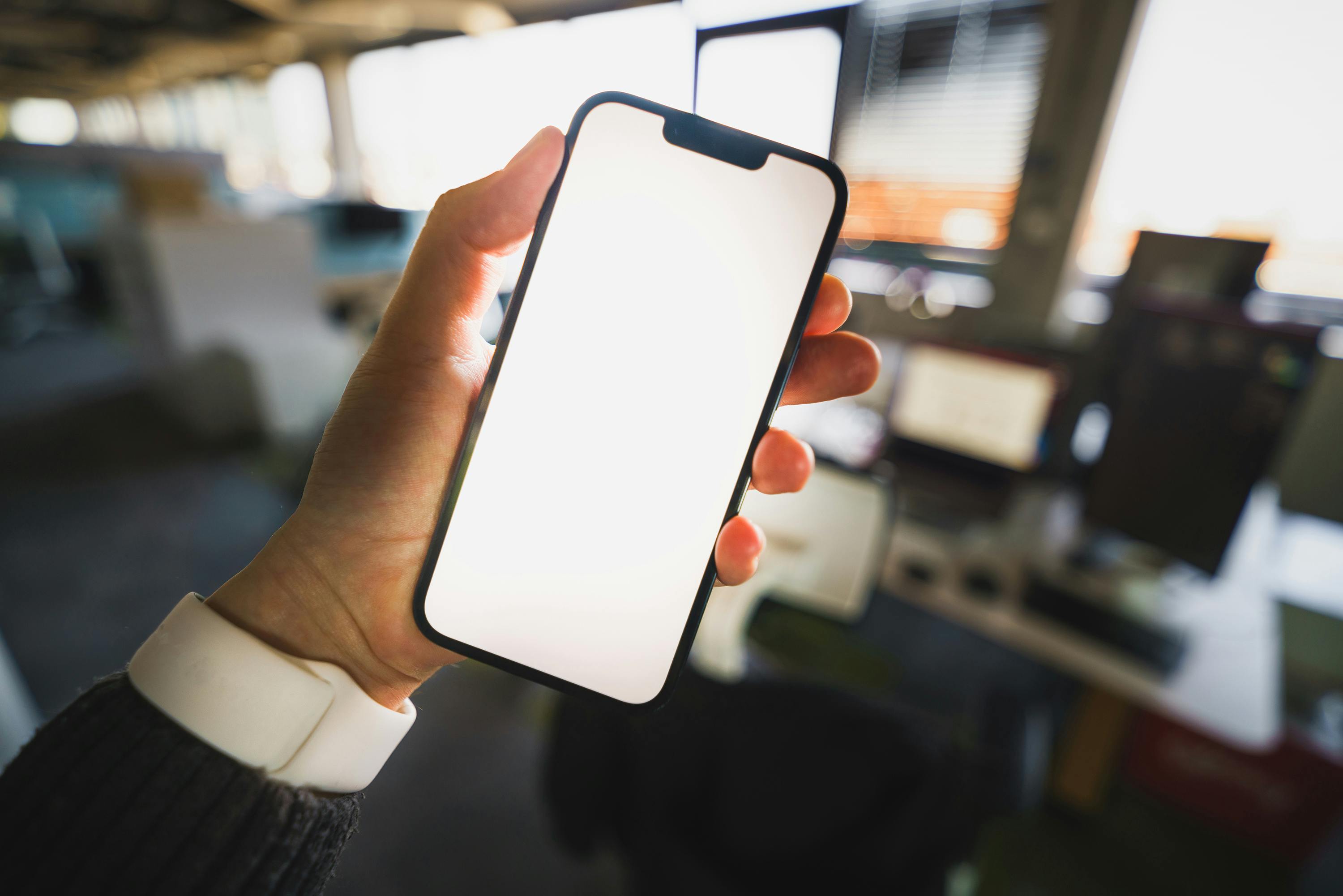 Mockup Smartphone Display in Office Setting · Free Stock Photo
