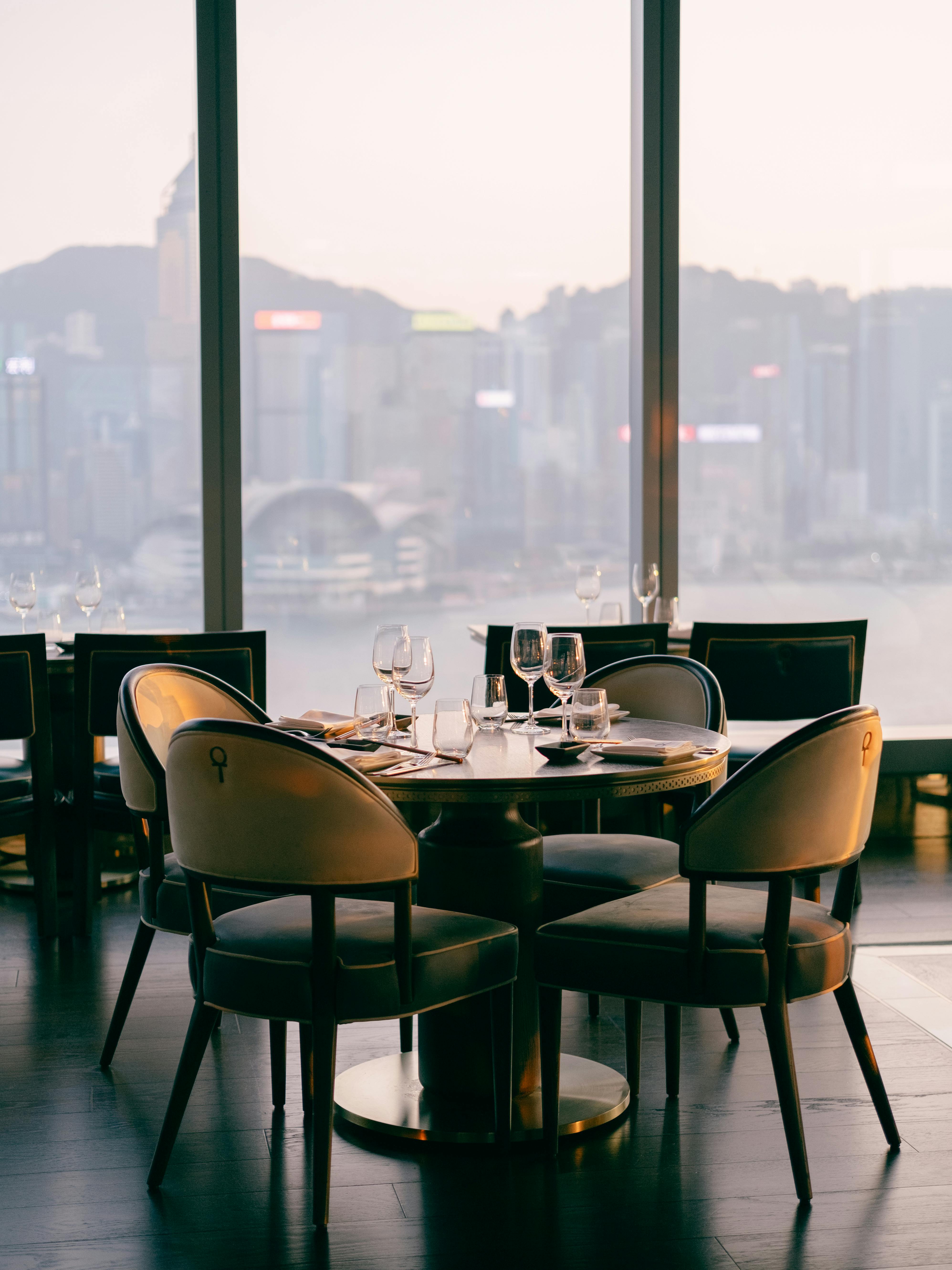 Elegant Restaurant Dining with Cityscape View · Free Stock Photo