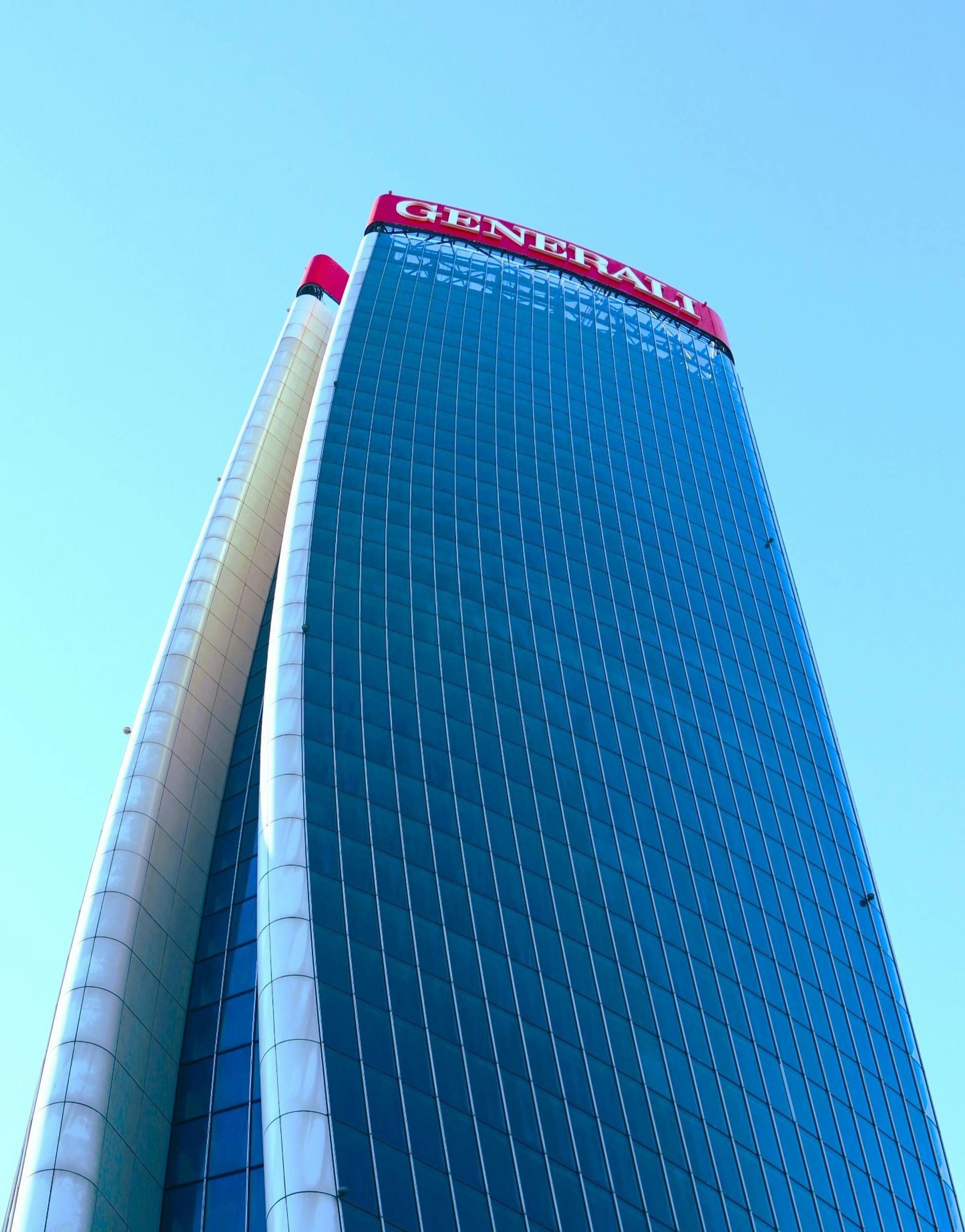 Generali Tower against Clear Blue Sky in Milan · Free Stock Photo