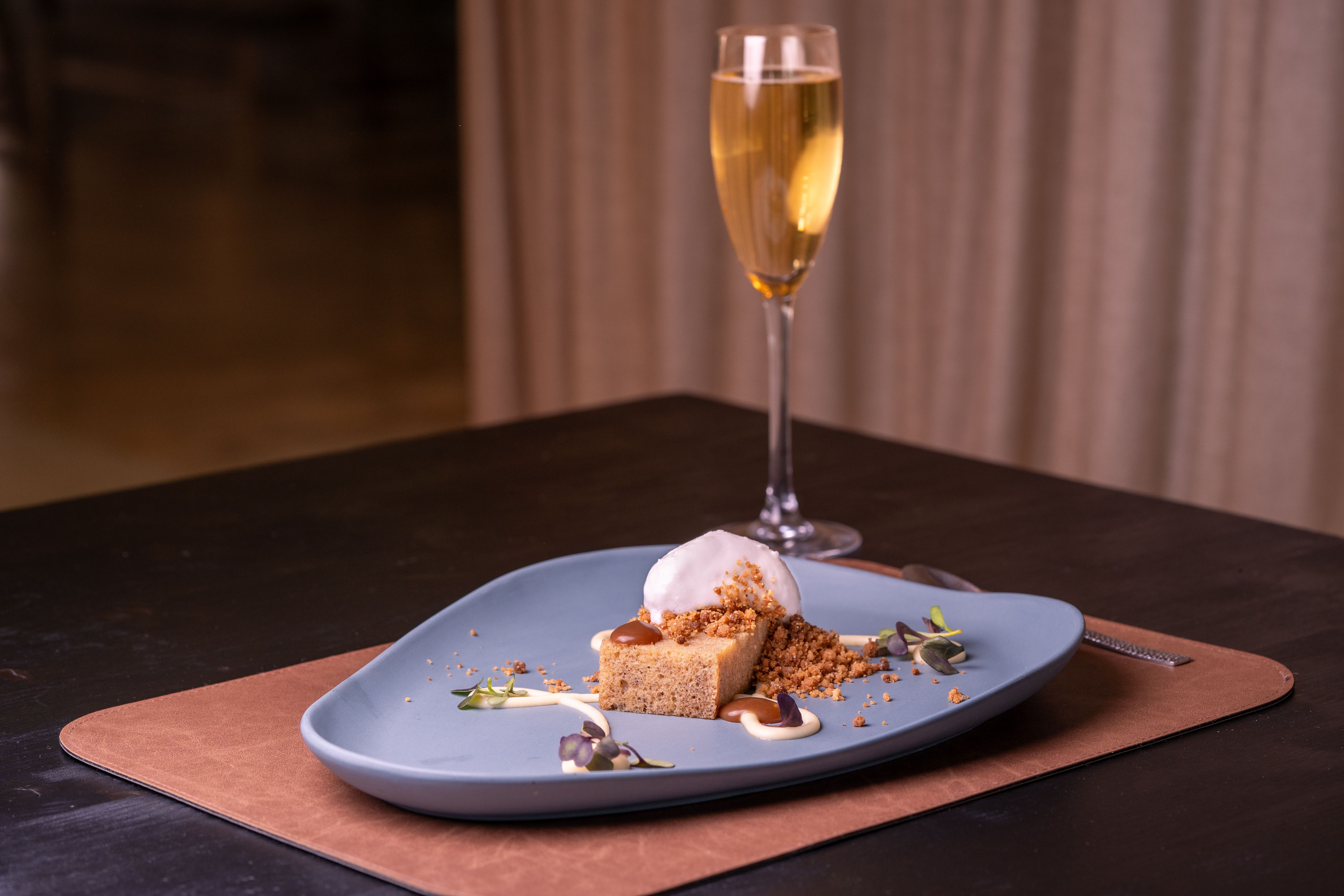 Elegant Dessert Plating with Sparkling Wine · Free Stock Photo