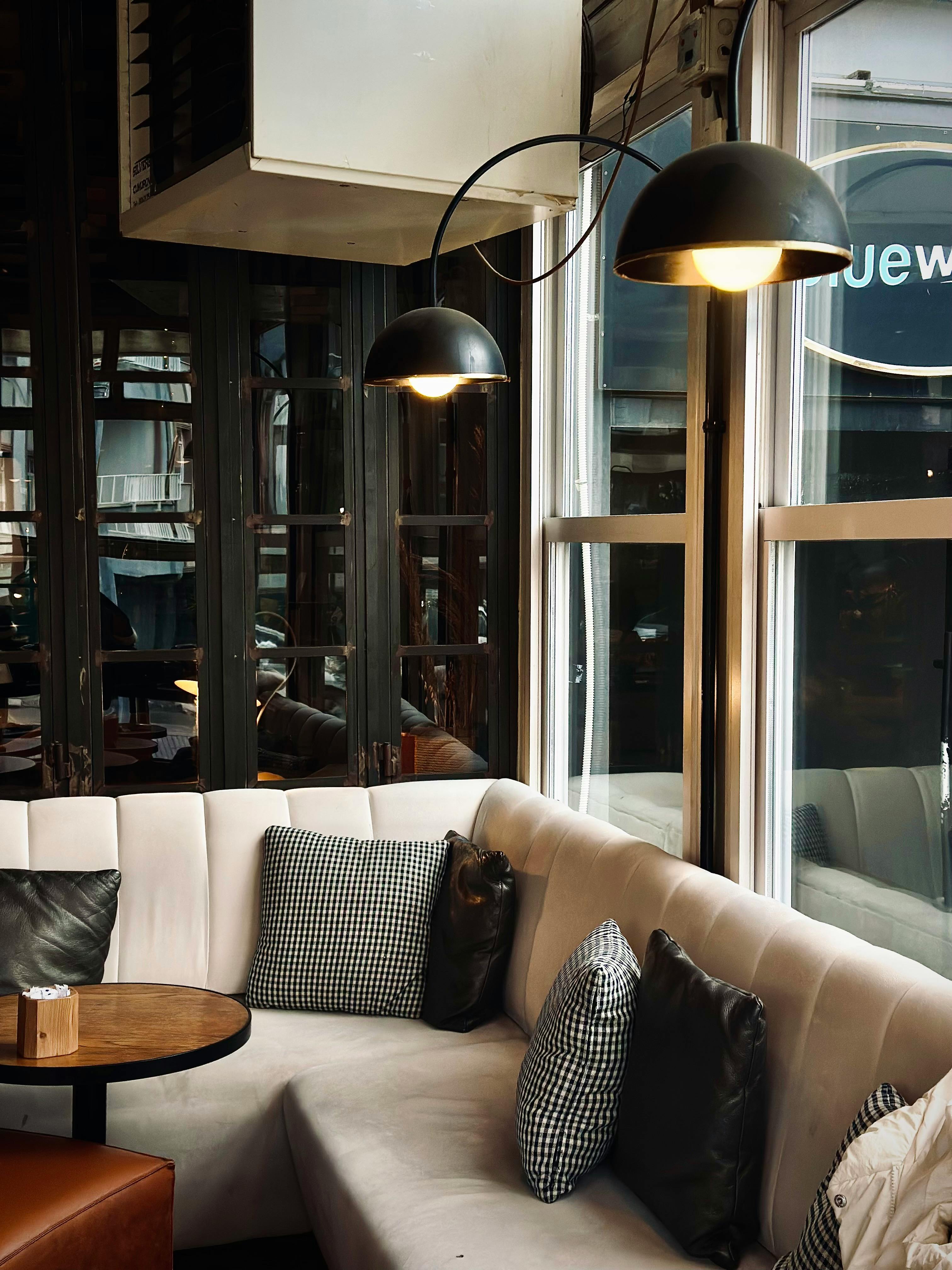 Cozy Modern Cafe Interior with Elegant Lighting · Free Stock Photo