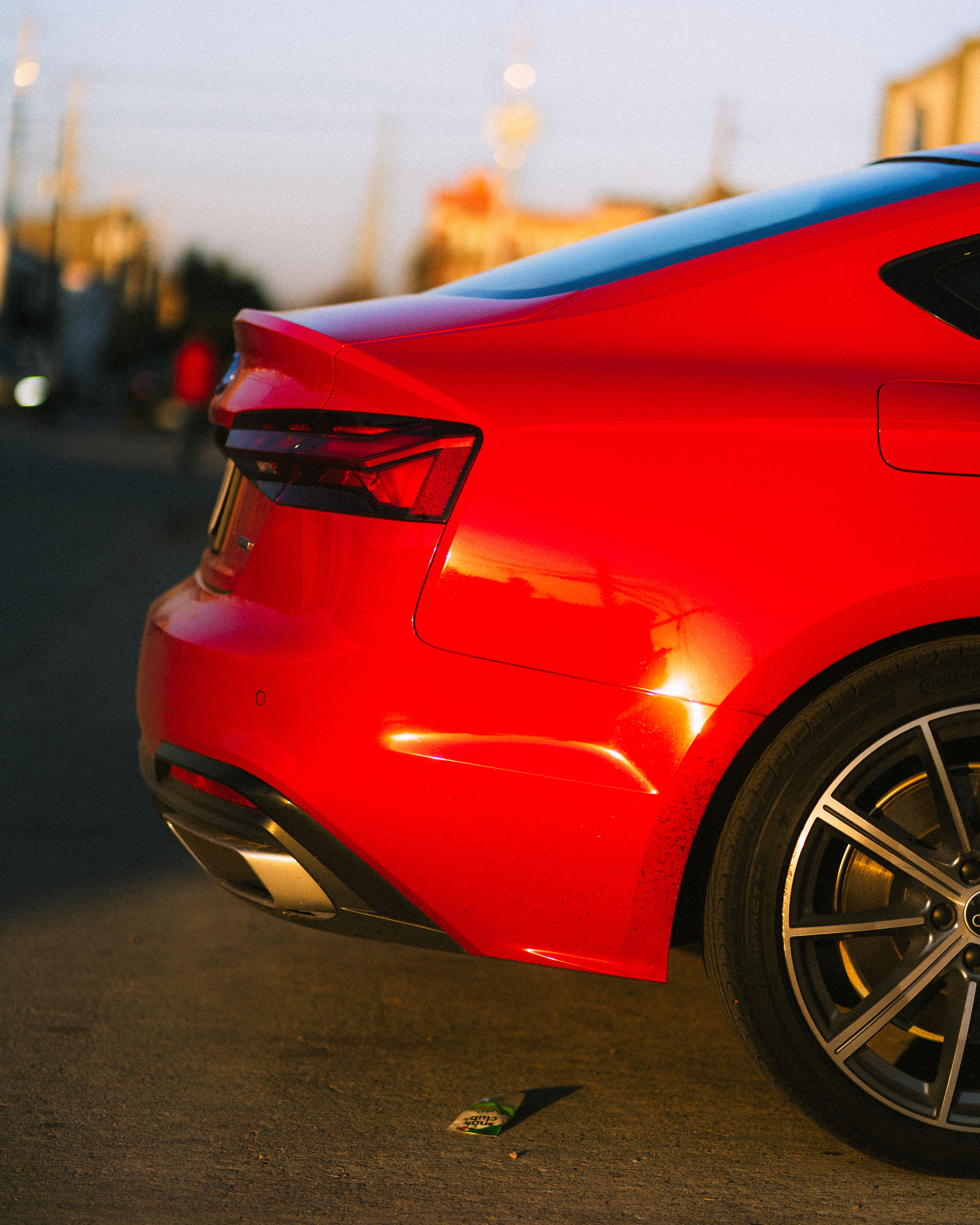 Vibrant Red Sports Car on Sunset Street · Free Stock Photo