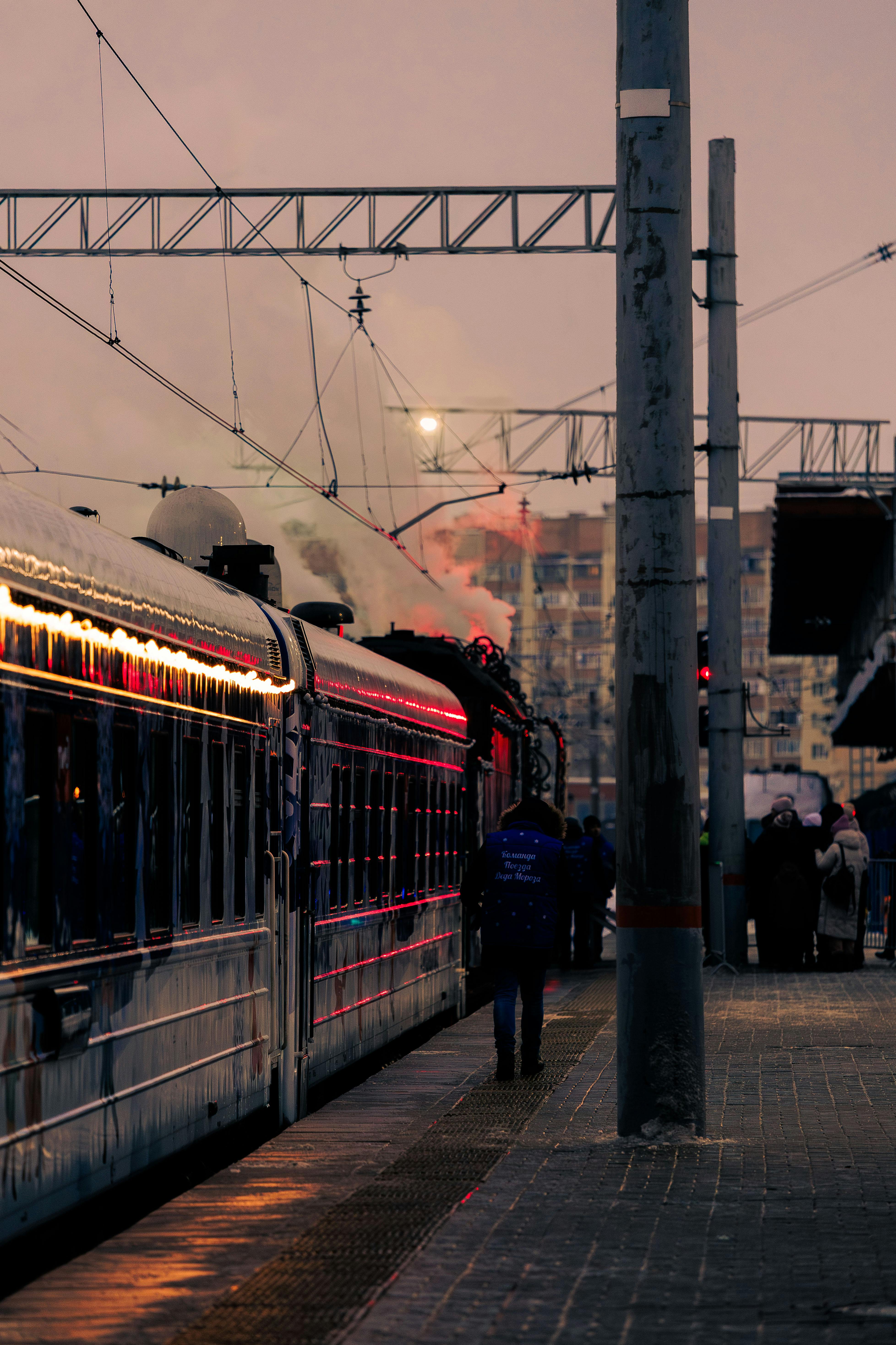 Moody Train Station at Dusk with Steam Engine · Free Stock Photo
